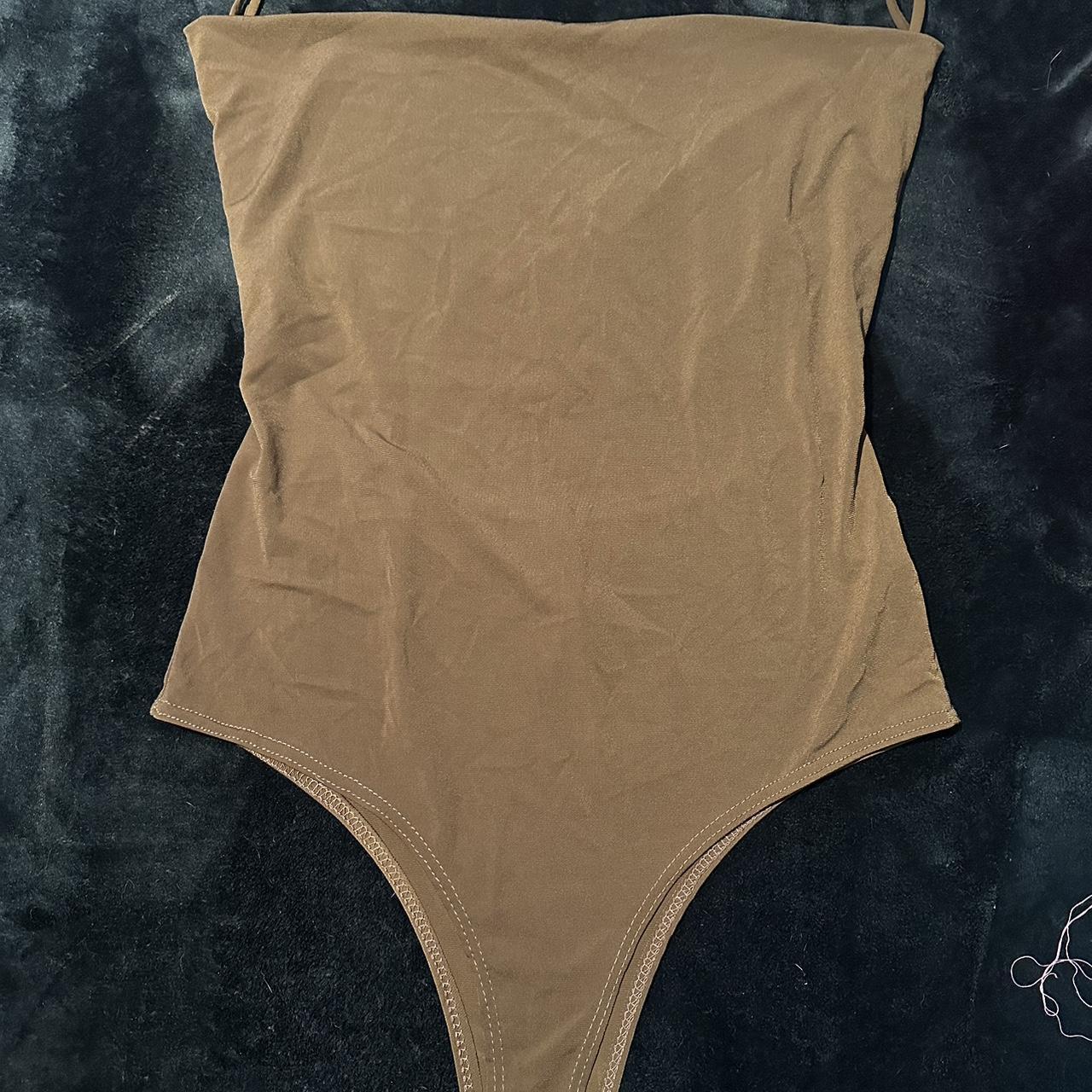 Brown backless bodysuit ,never worn ,stretchy - Depop