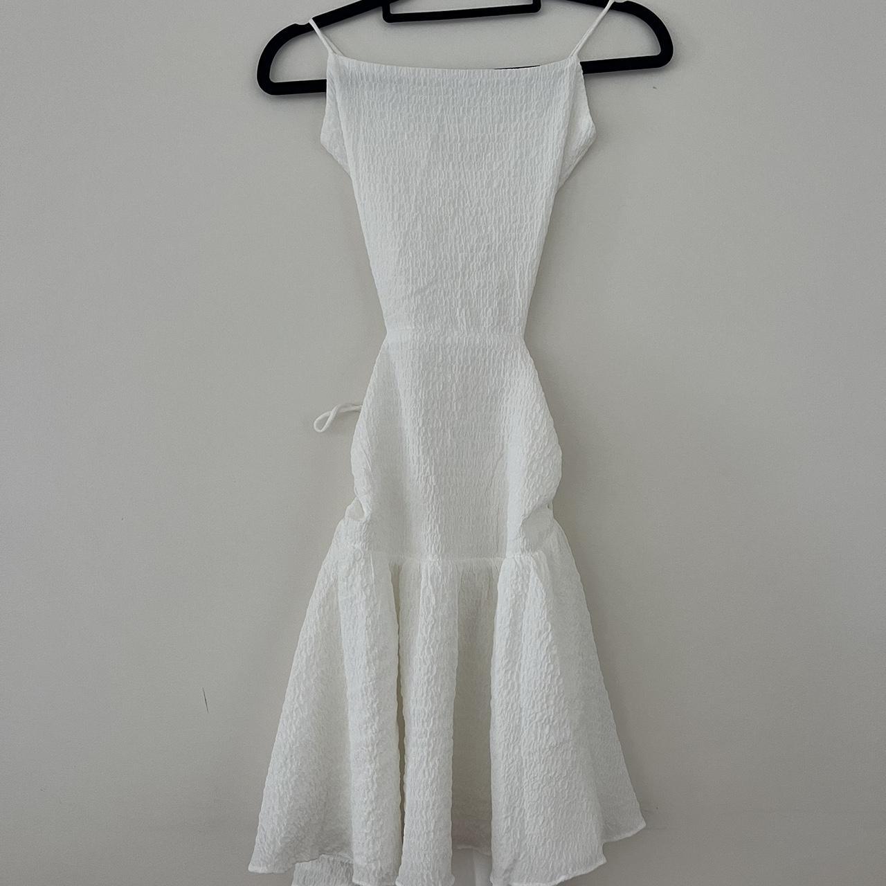 SABO - White mini dress with adjustable straps, cut... - Depop