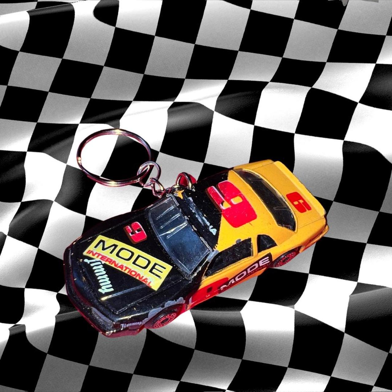 Yellow and black Jimmy Moore race car keychain... | Depop