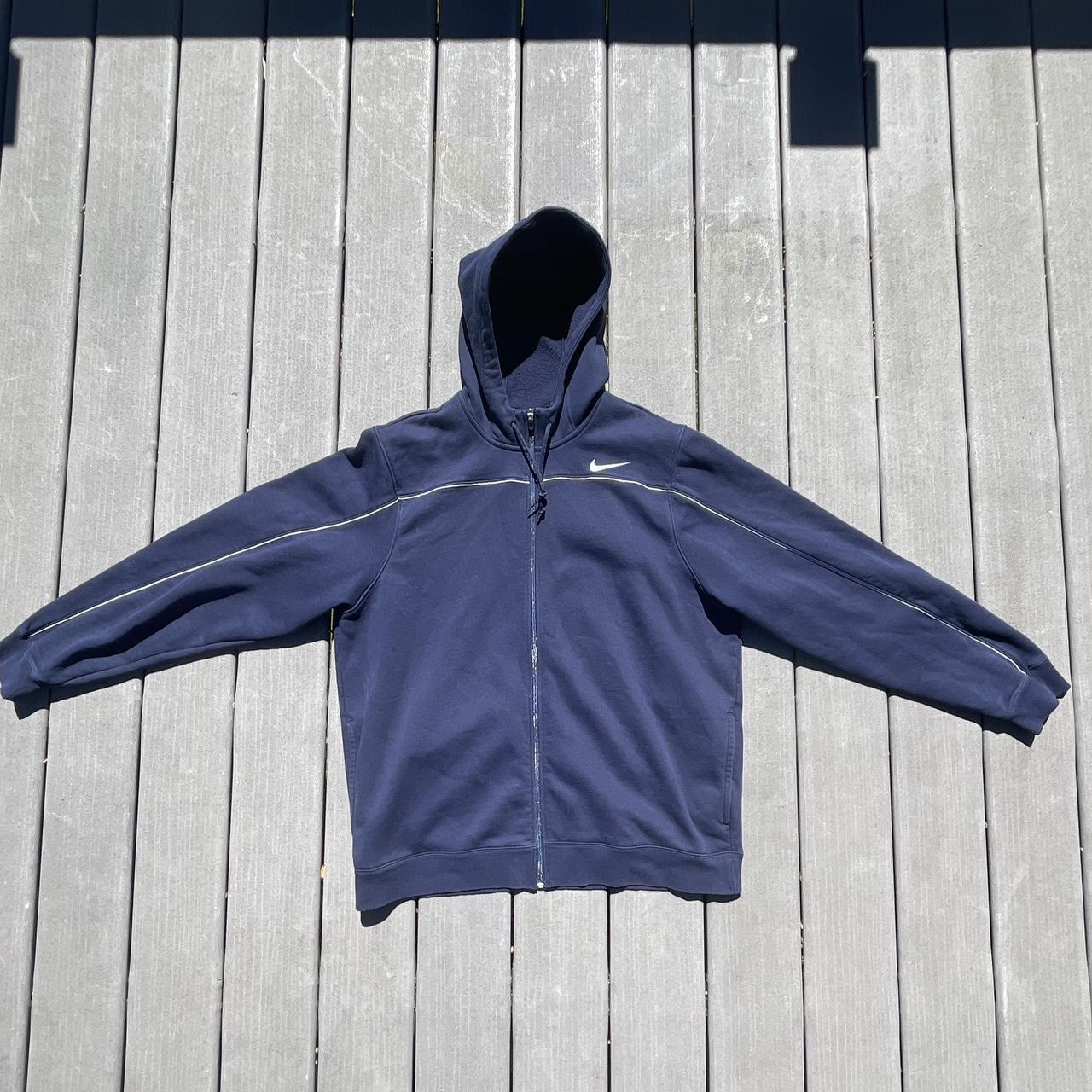 Blue Nike zip up with white line design throughout. - Depop