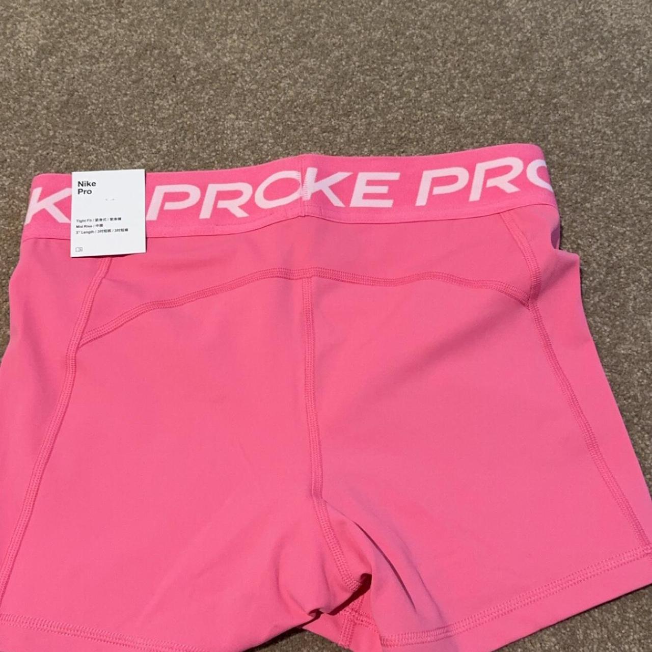 hot pink nike pros, never been worn and still has... - Depop