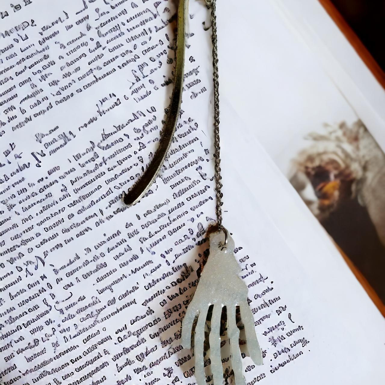 Skeleton hand bookmark. Handmade. Media is metal and... - Depop