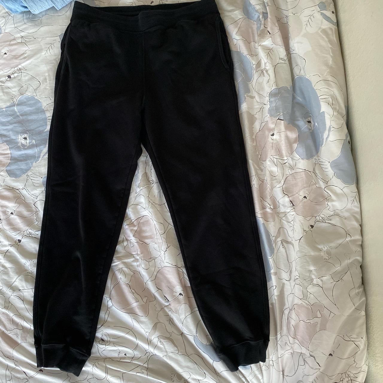 Uniqlo Black cuffed sweatpants Size XL but fit more... - Depop