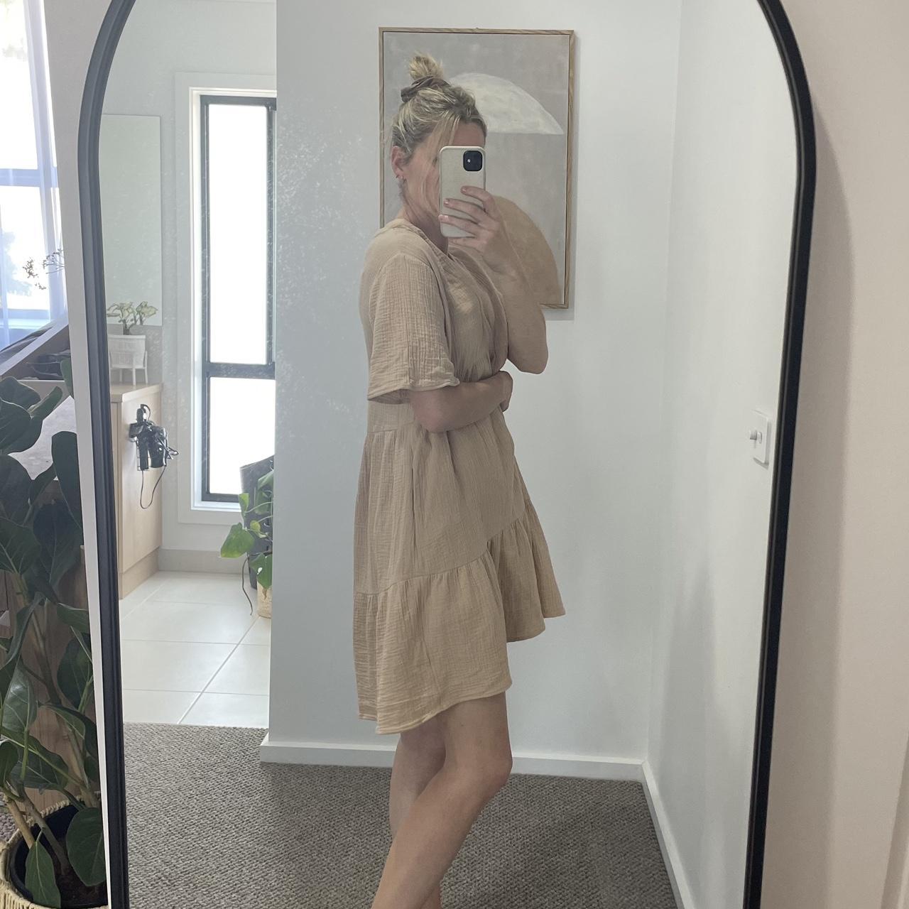 Tan and cream linen dress with a V neck and flared... - Depop