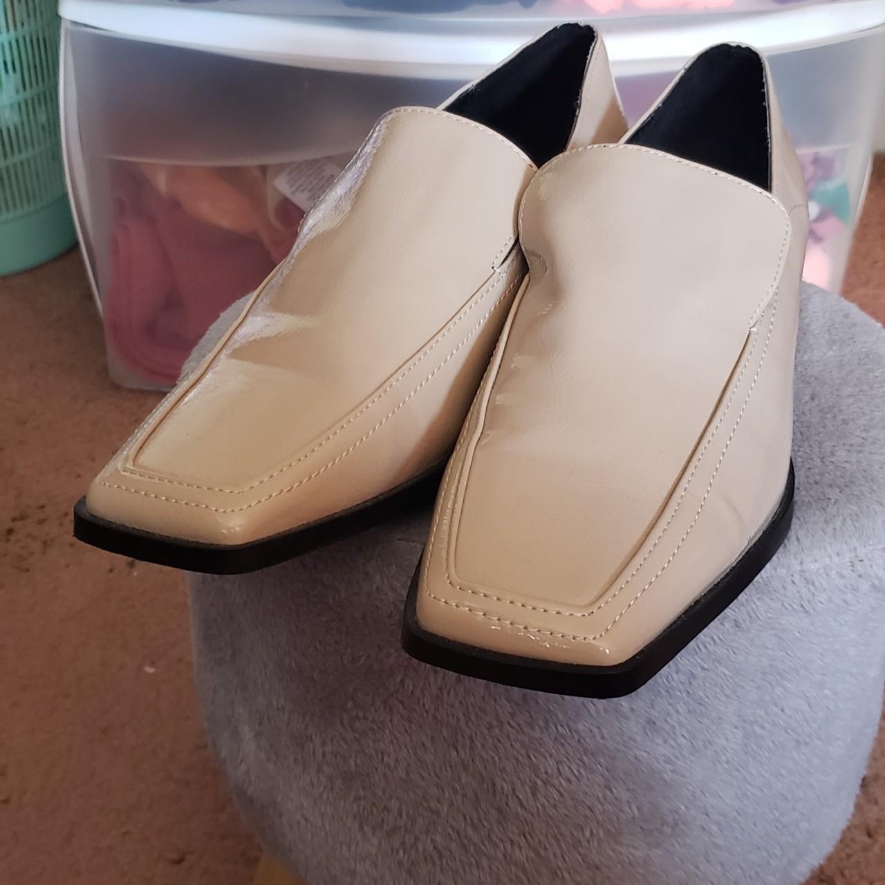 Cream colored loafer like shoes. Has a black spot on... - Depop