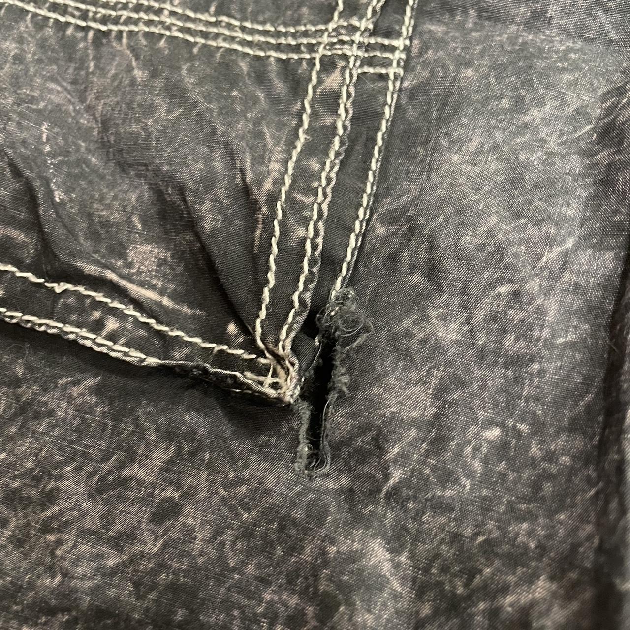 Black acid wash cargo pants with a baggy fit. There... - Depop