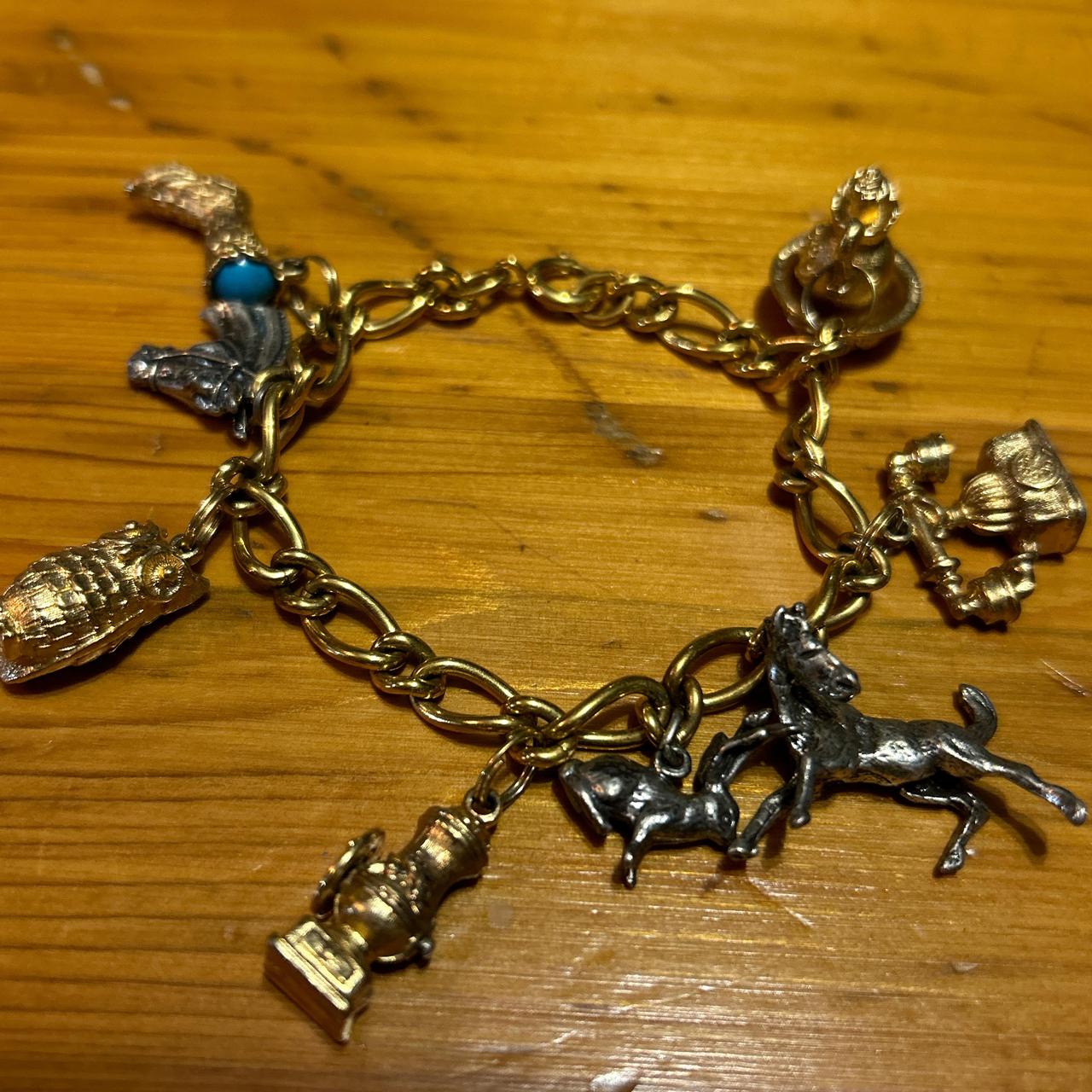 Gold tone AVON charm bracelet with horse, shoes,... - Depop