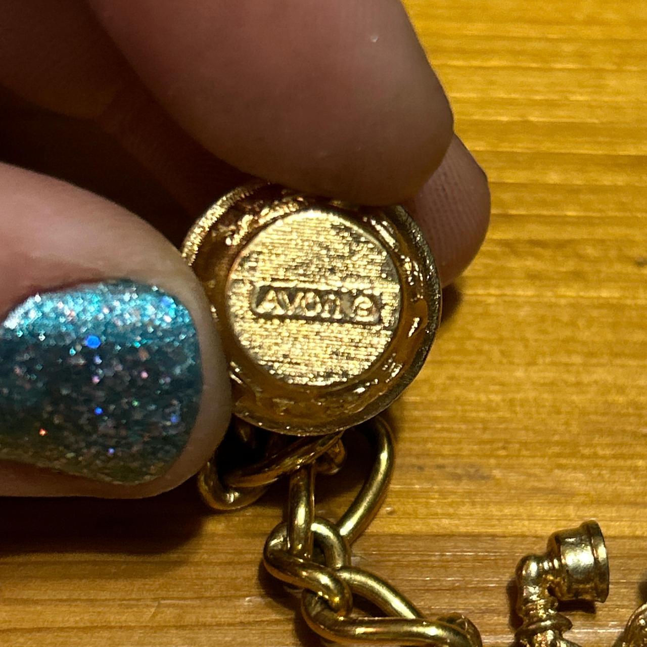 Gold tone AVON charm bracelet with horse, shoes,... - Depop