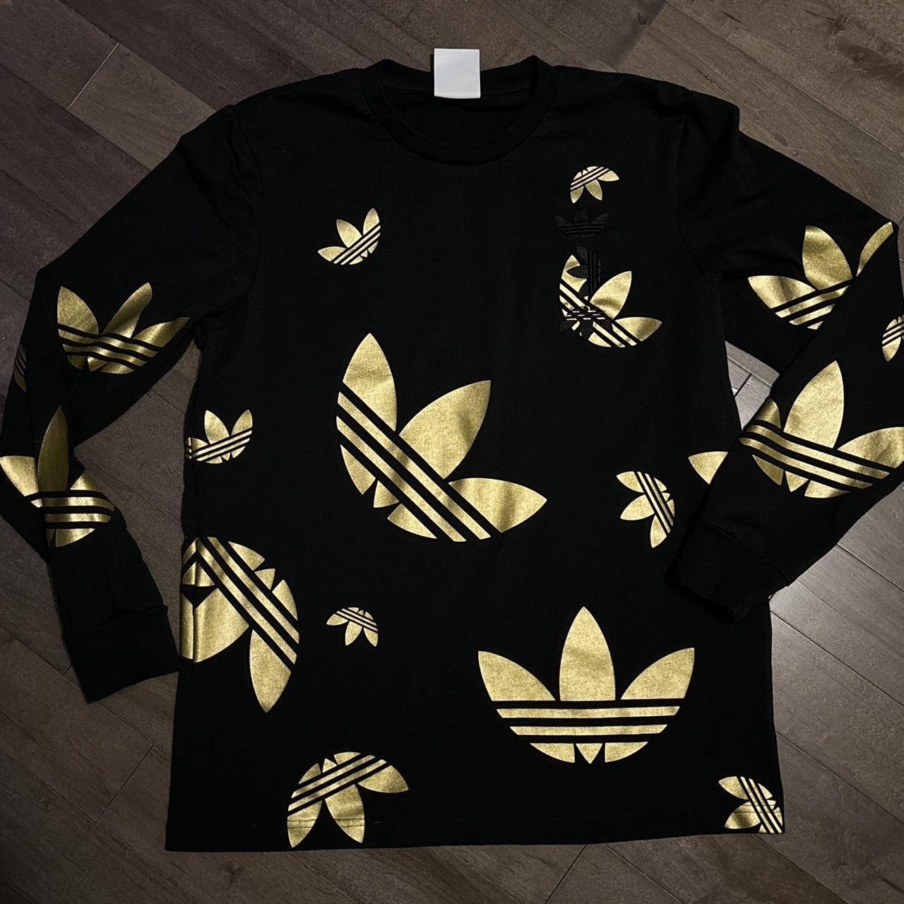 Adidas Men's Black And Gold Leaf Logo Graphic Shirt... - Depop