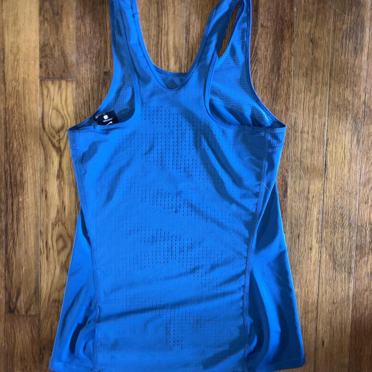 Nike blue racerback tank top Torso 21 inches Bust... - Depop