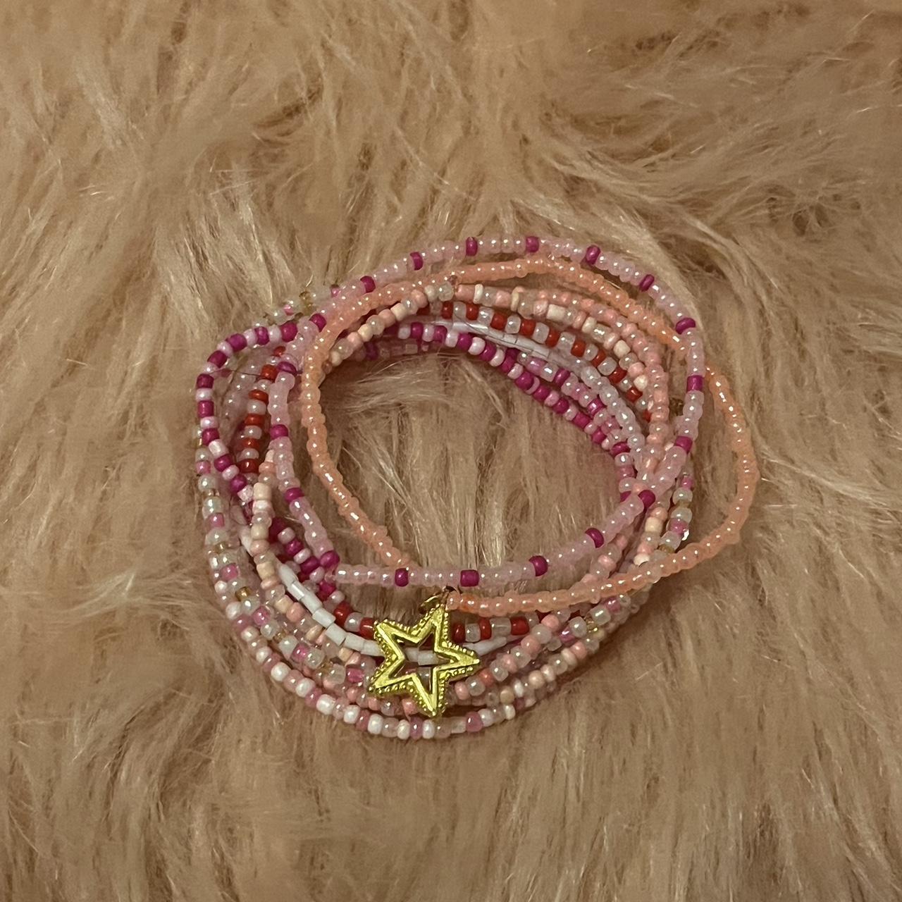11 pink braclets w star... - Depop
