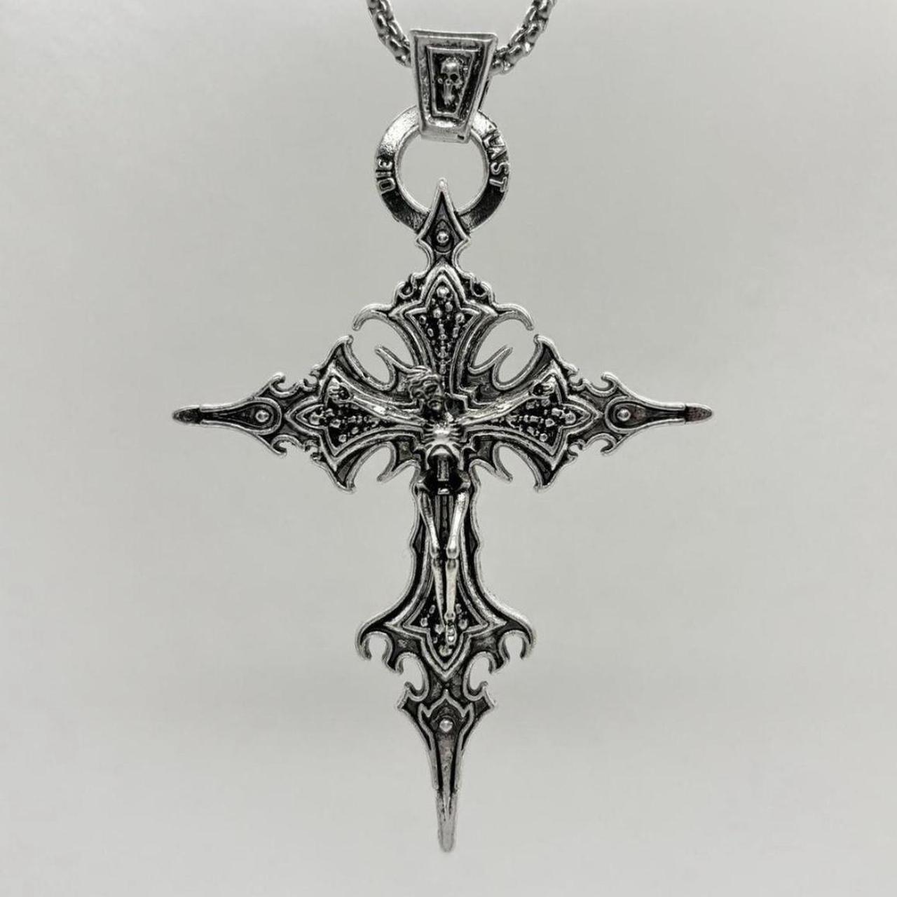 TUFF Goth y2k cross pendant necklace with a skeleton... - Depop