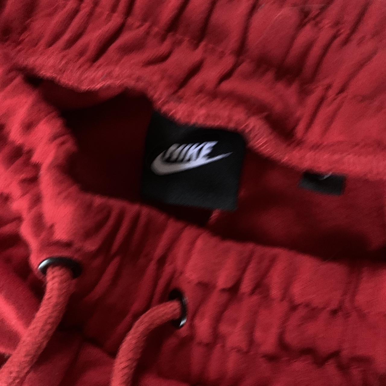 Red nike sweatpants with zip up pockets - Depop