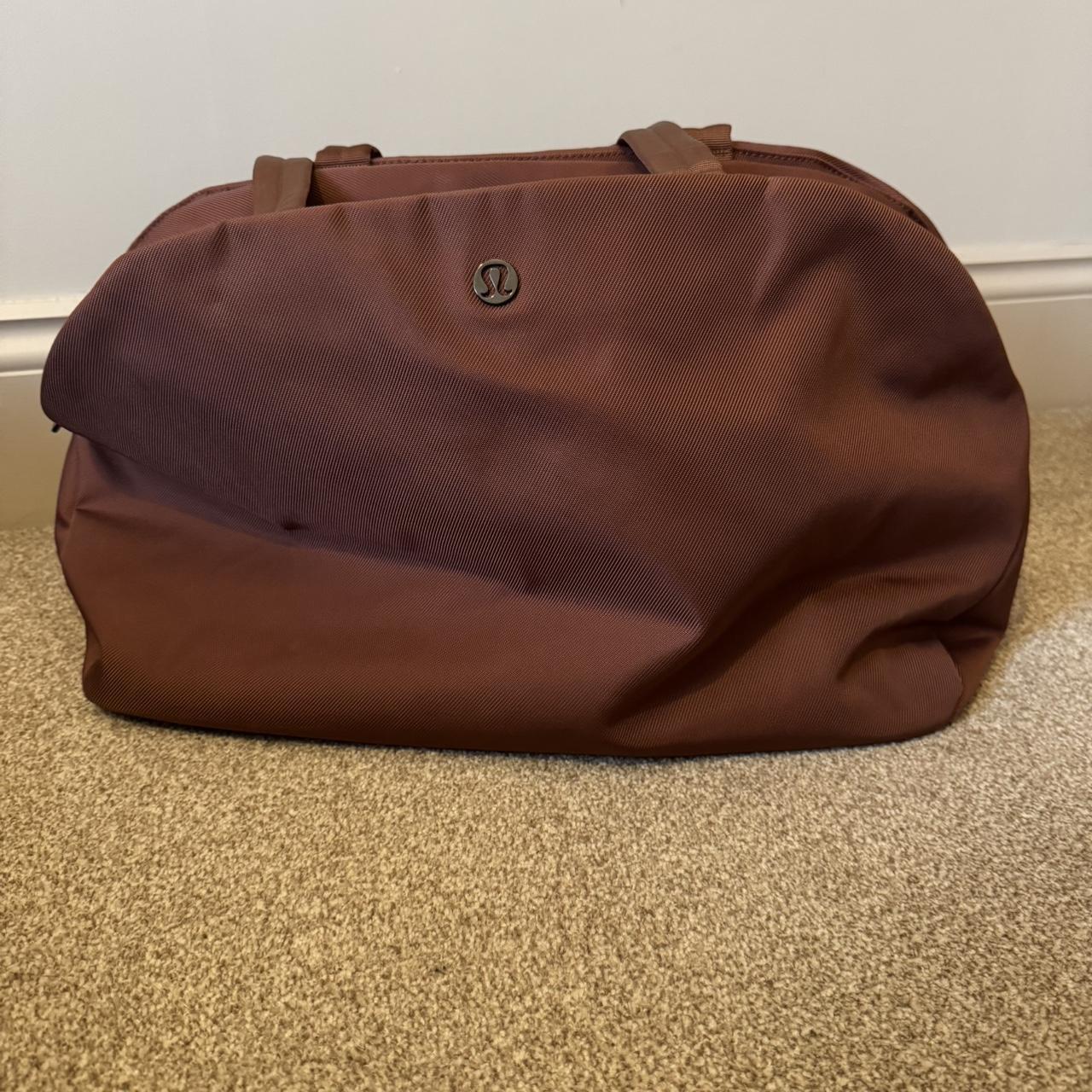 Large lululemon duffle bag with lots of pockets... | Depop