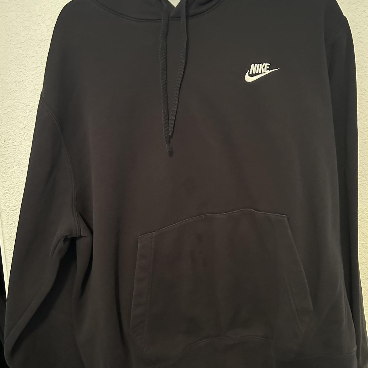 large black Nike hoodie with slight flaws shown in... - Depop