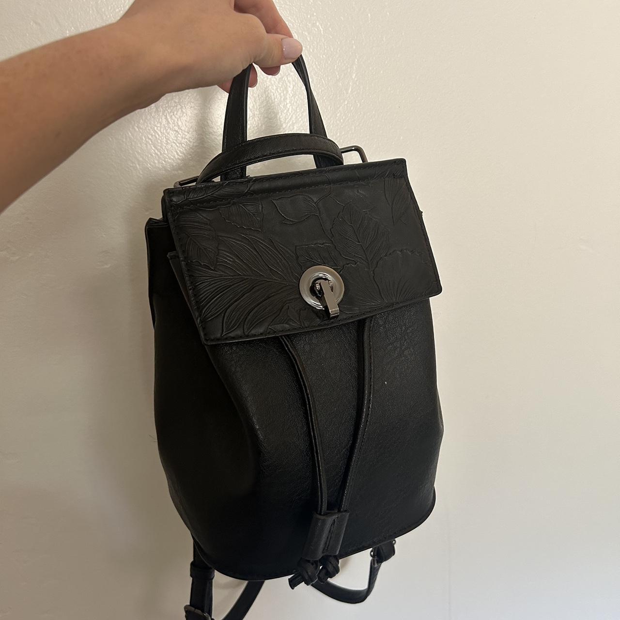 Vintage black leather backpack with a silver buckle,... - Depop
