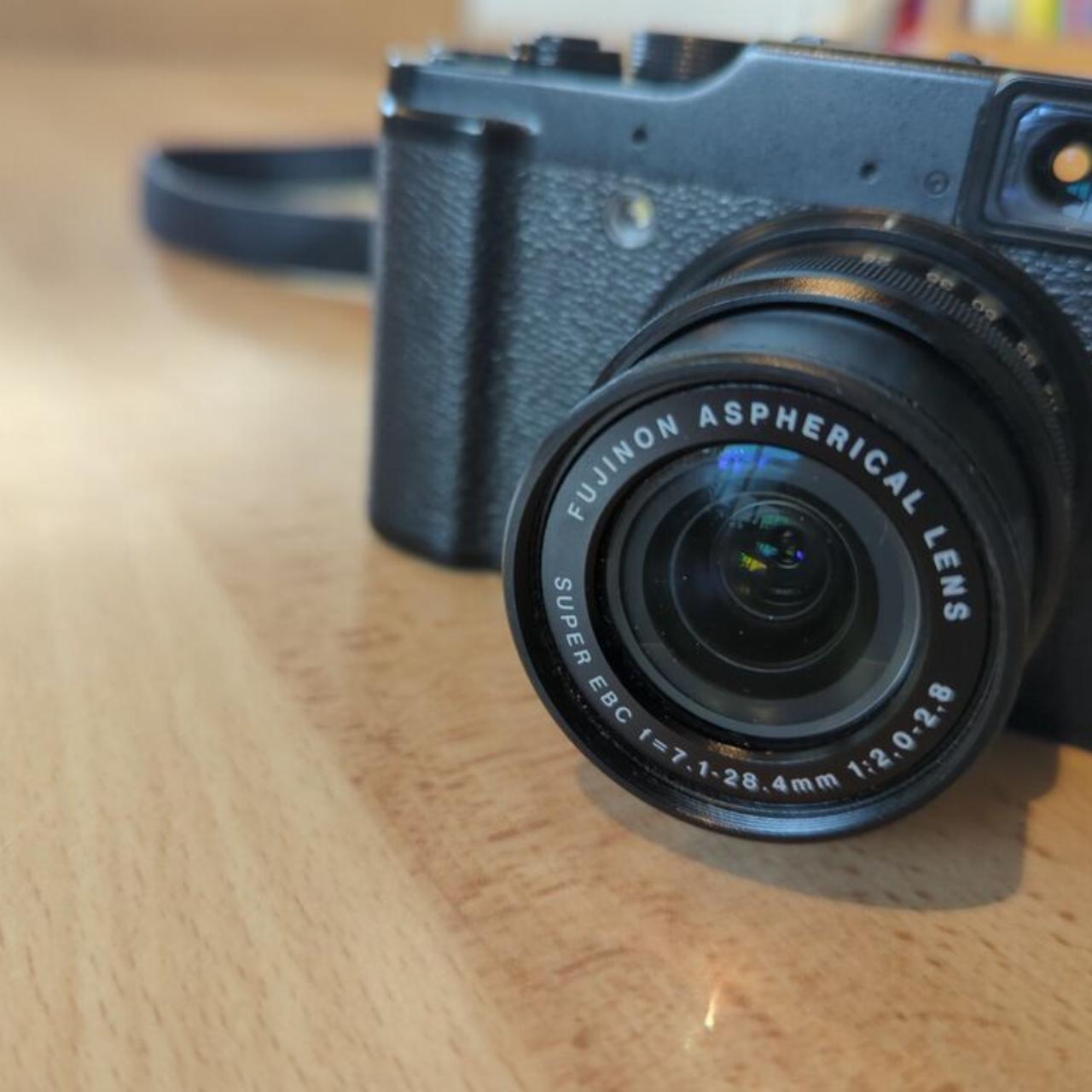 A FUJIFILM X10 digital camera with accessories. The... - Depop