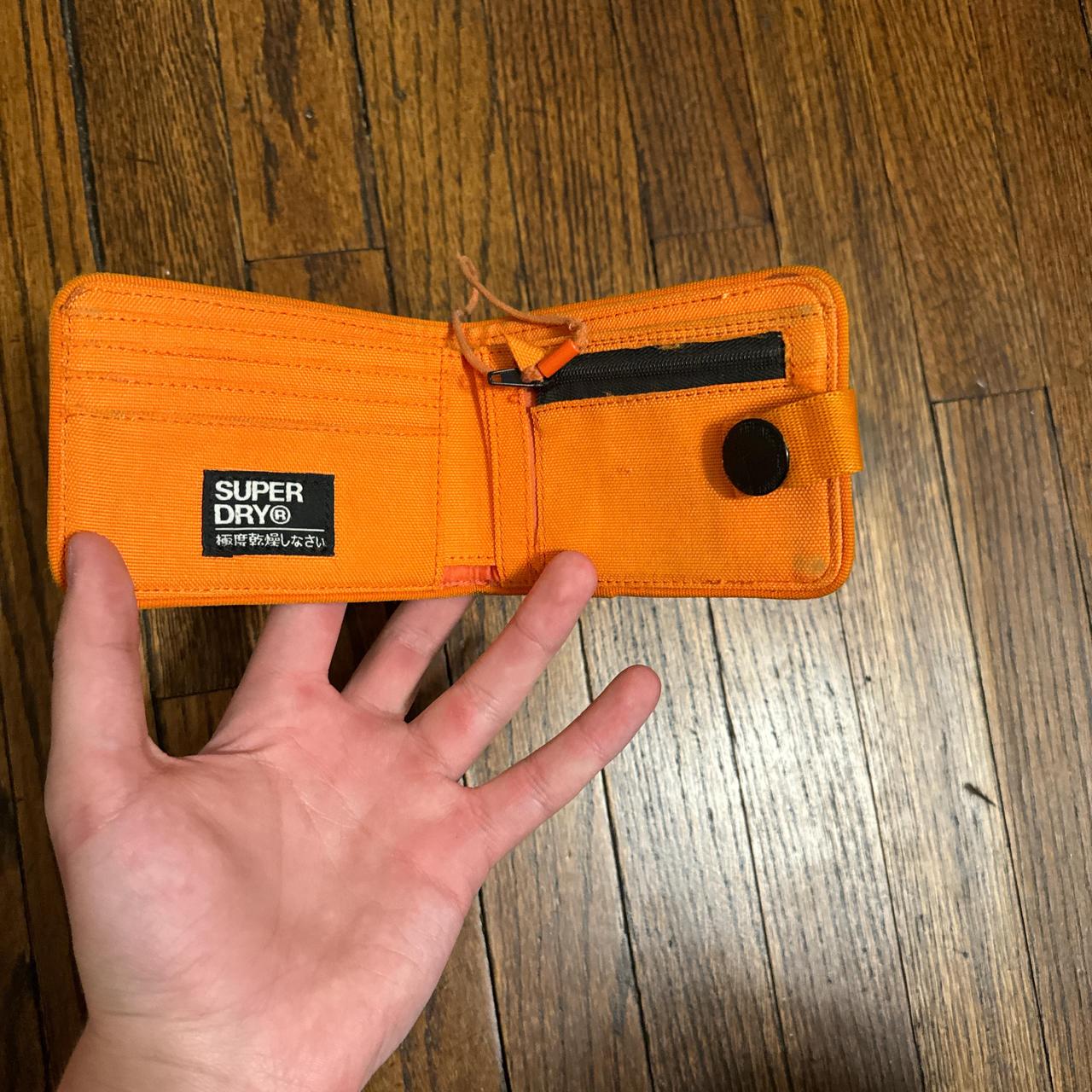 orange Superdry wallet, used well, no damage button... - Depop