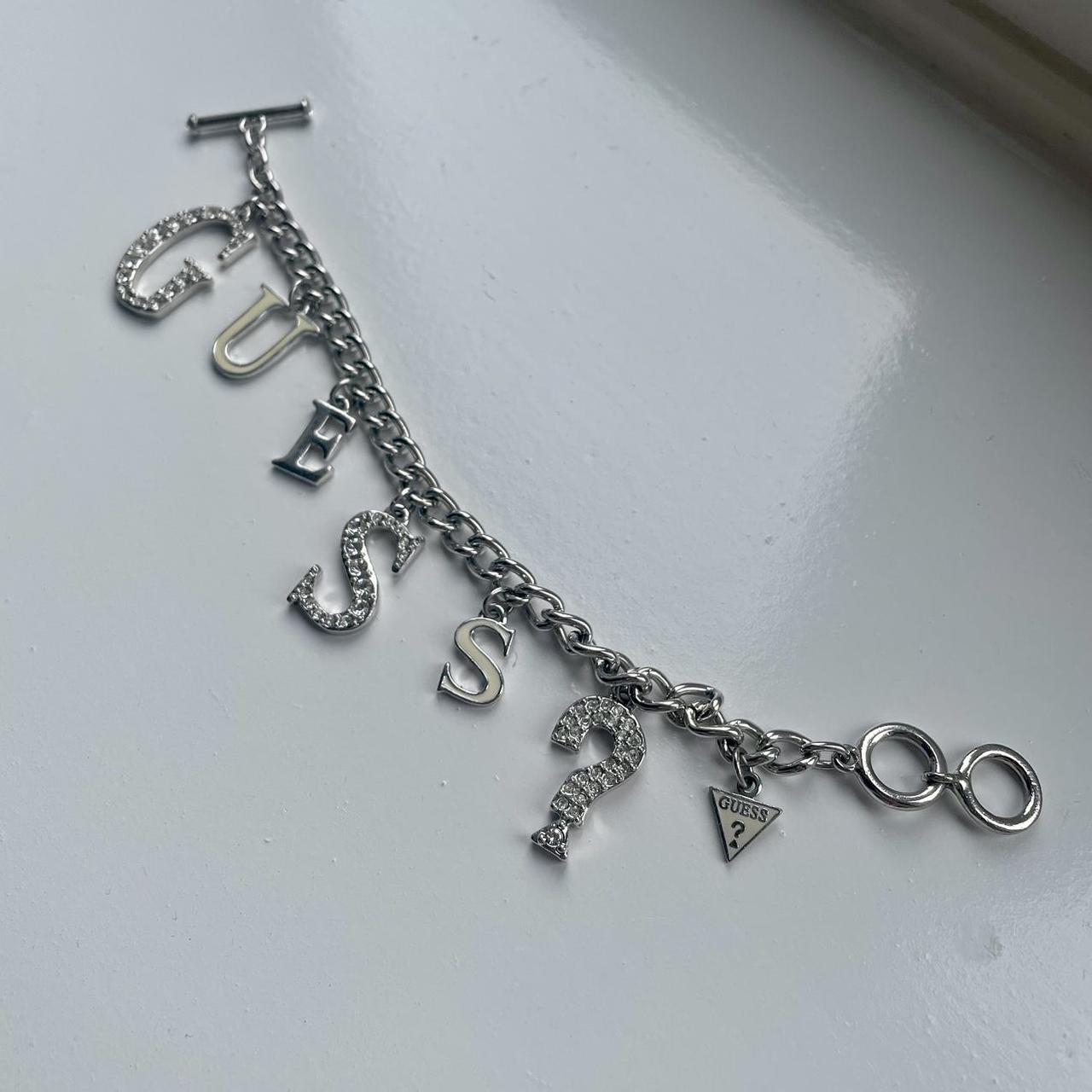 Guess Silver Letter Logo Bracelet • Six charms... - Depop