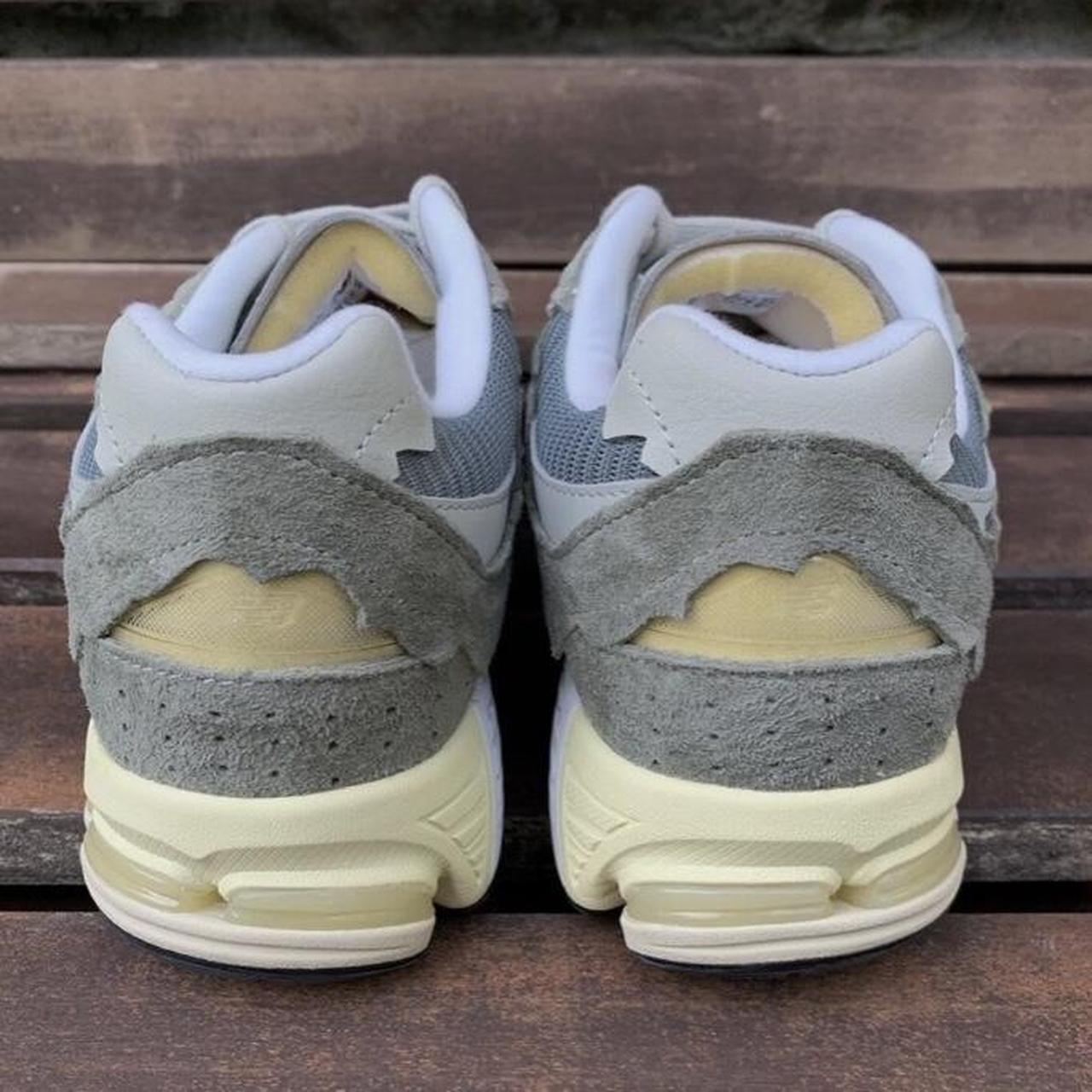 Grey and yellow New Balance 2002r protection pack... | Depop