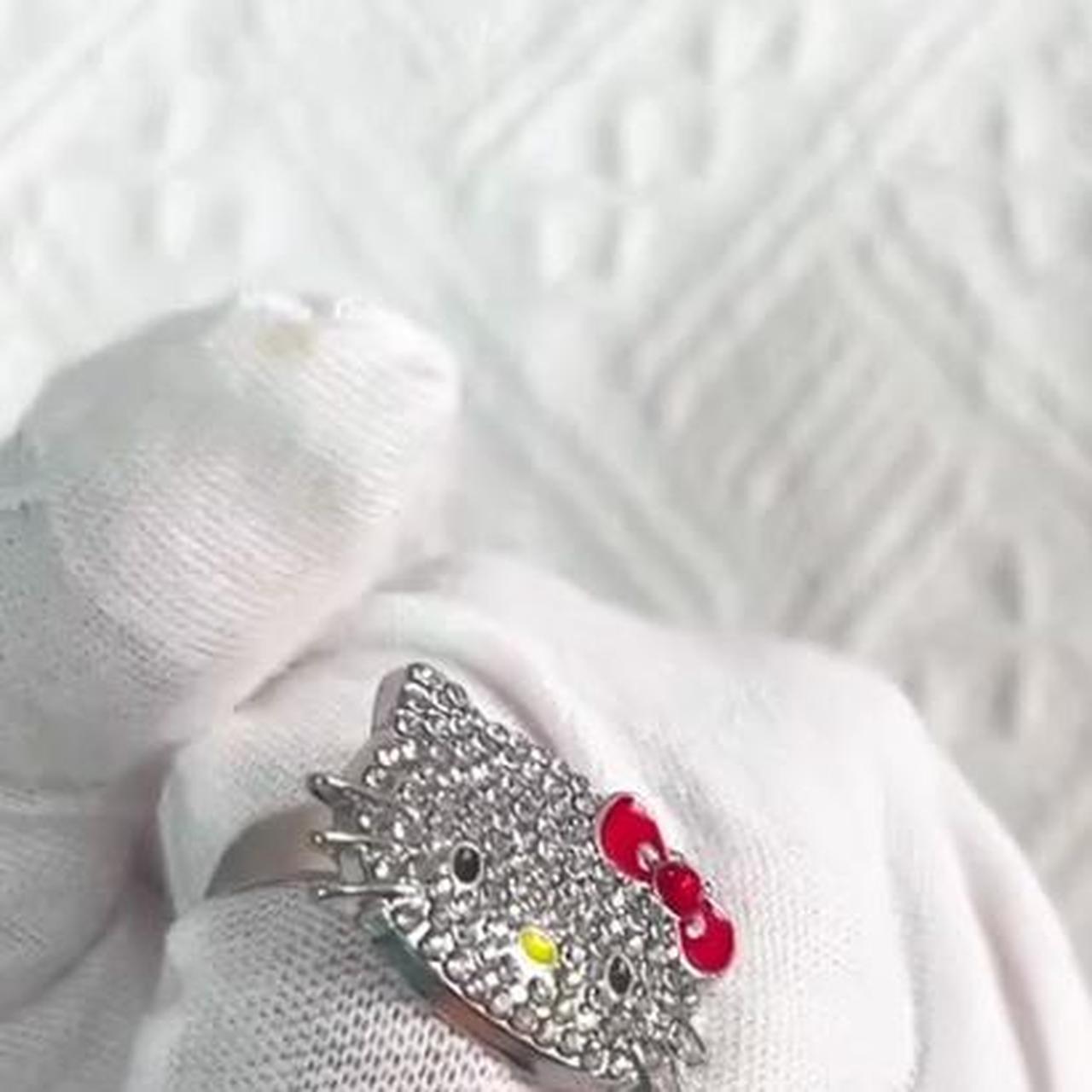 Silver Hello Kitty ring with red and yellow... - Depop
