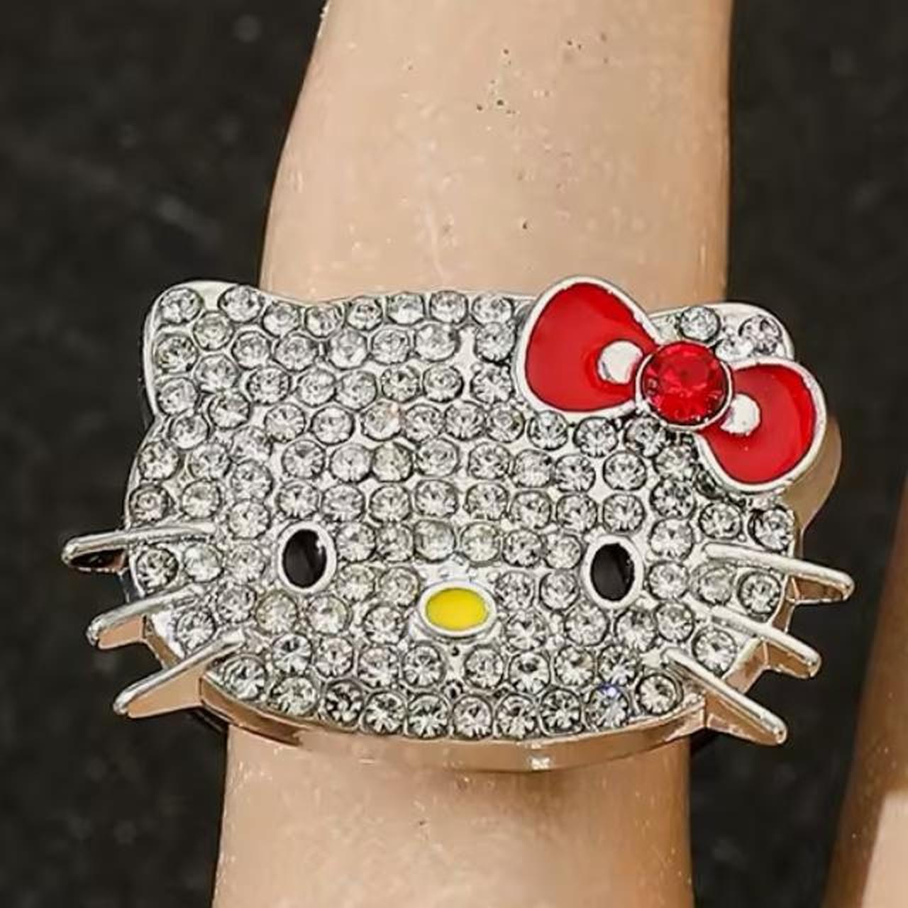 Silver Hello Kitty ring with red and yellow... - Depop