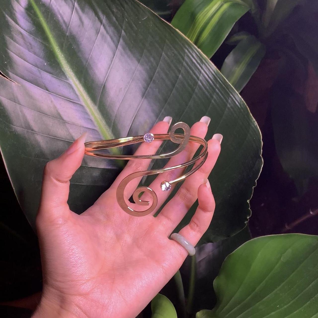 Golden arm cuff Get a discount with the details in... - Depop