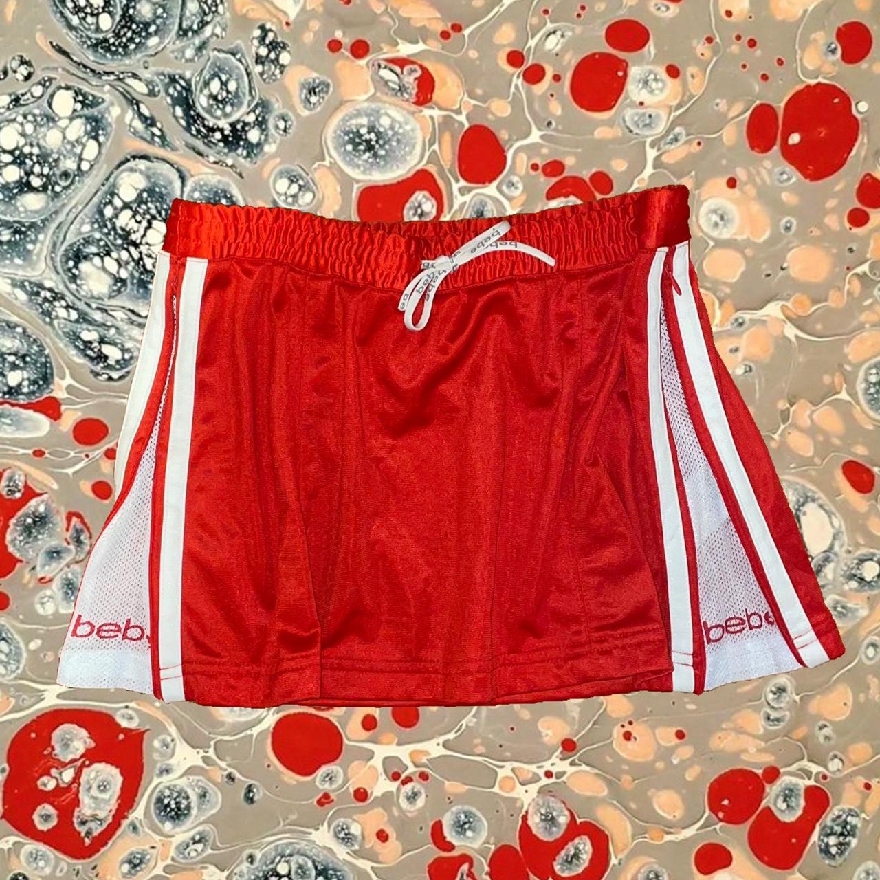 Super cute unique Bebe sporty miniskirt. Both sides... - Depop