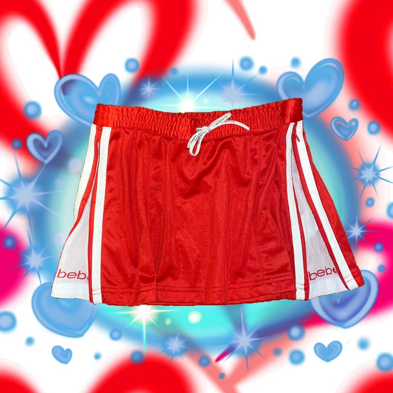 Super cute unique Bebe sporty miniskirt. Both sides... - Depop
