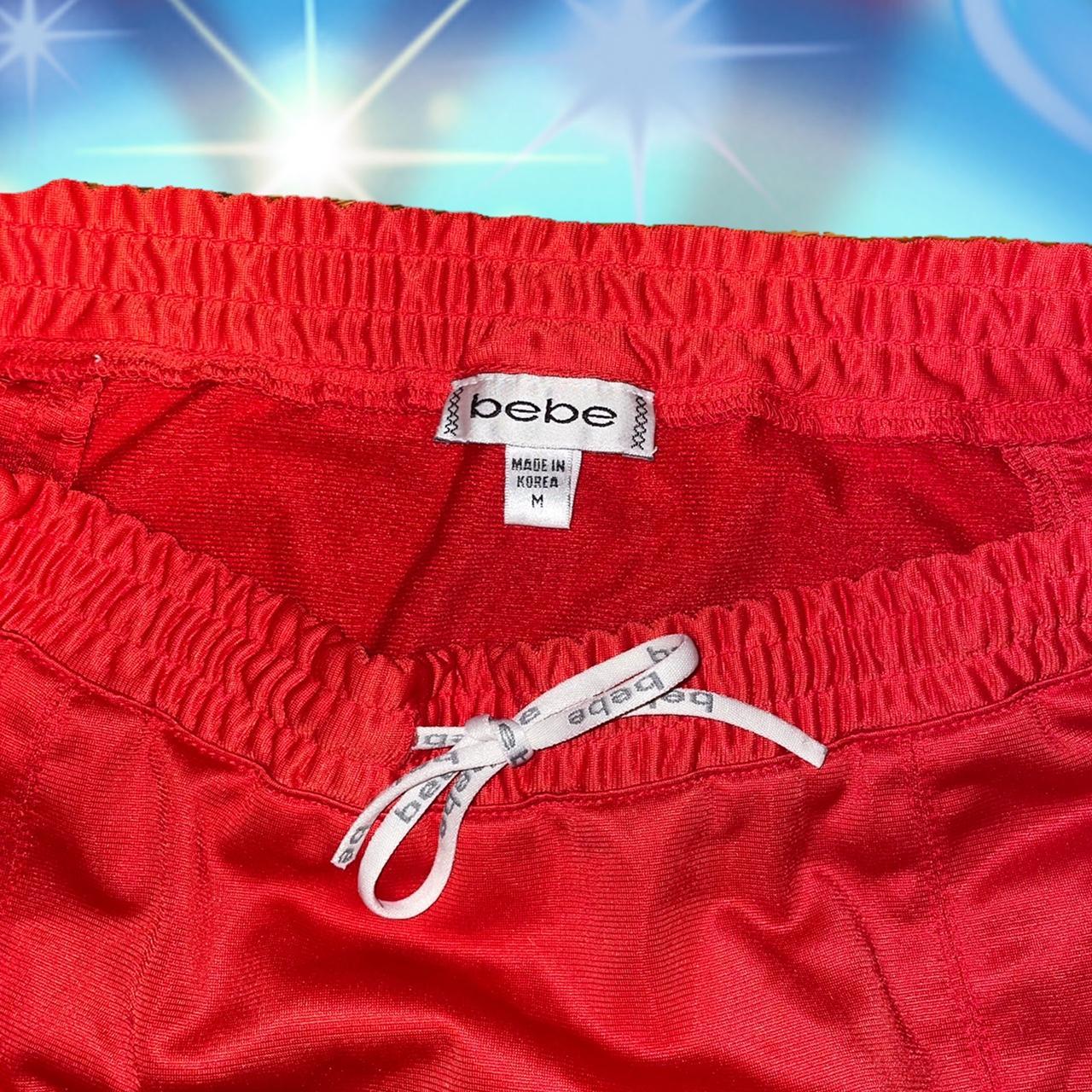 Super cute unique Bebe sporty miniskirt. Both sides... - Depop