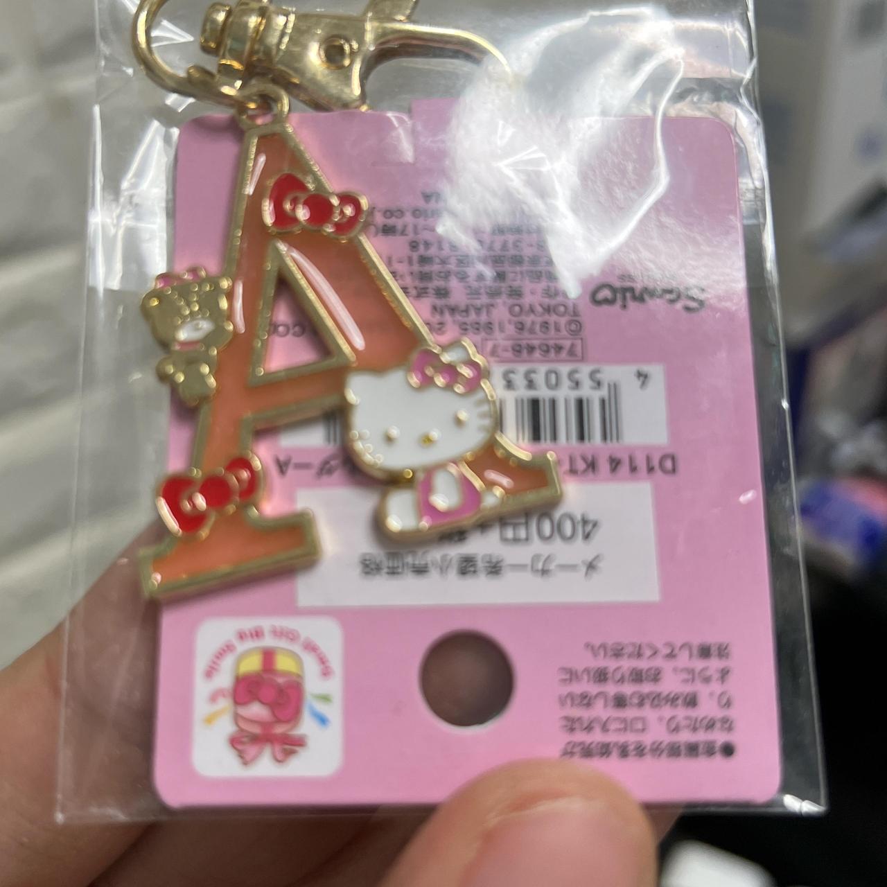 Sanrio original Hello Kitty metal keychain Letter... - Depop