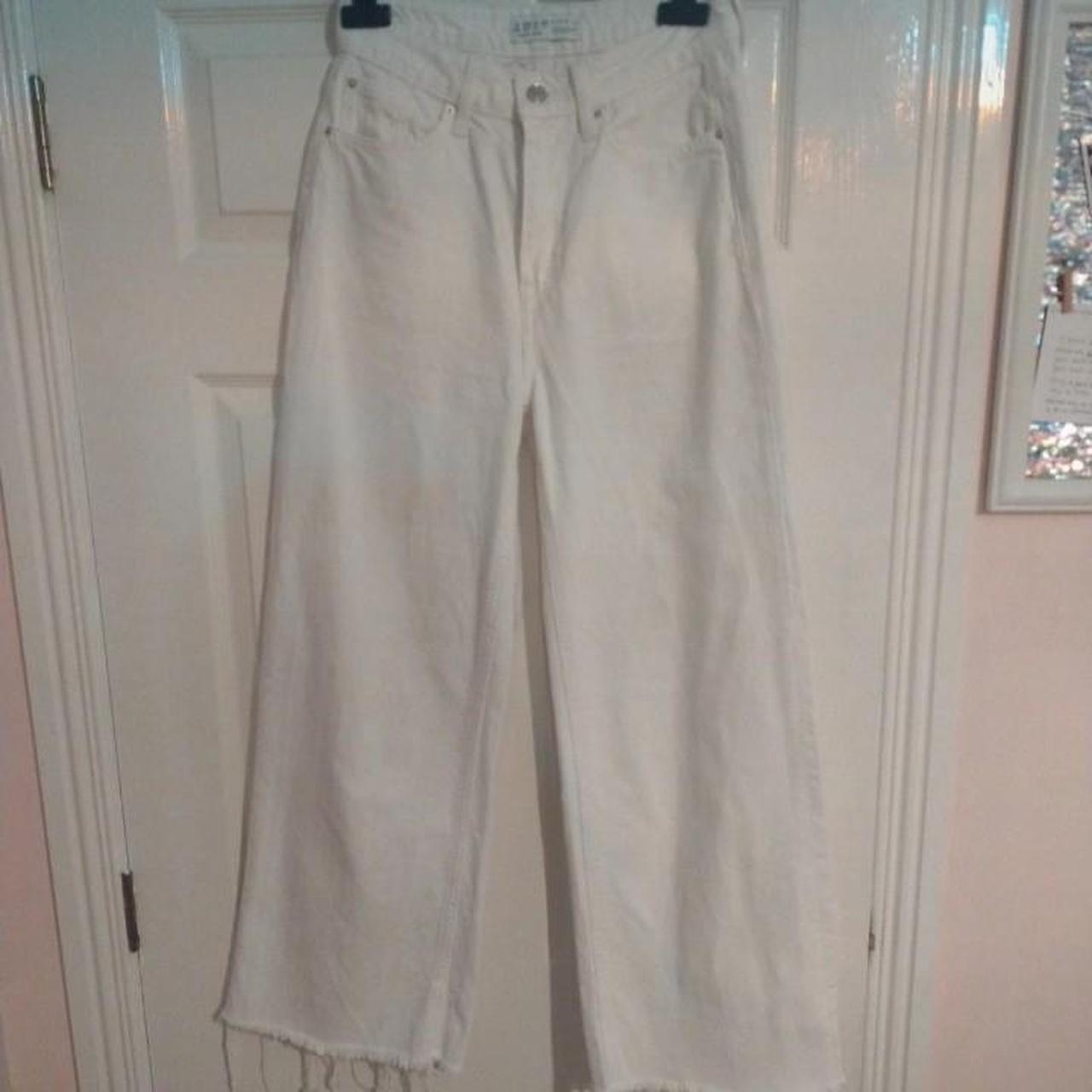 Straight leg white jeans with tassel-y threads on... - Depop