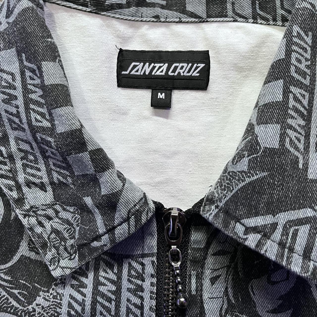 Santa Cruz black and white zip-up jacket with a tiny... - Depop