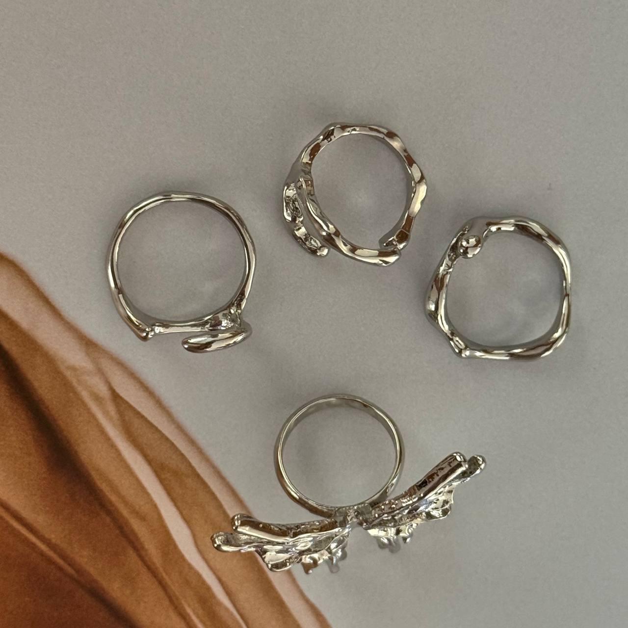 SCULPTURAL BUTTERFLY RING SET (4-PIECE) fluid... | Depop
