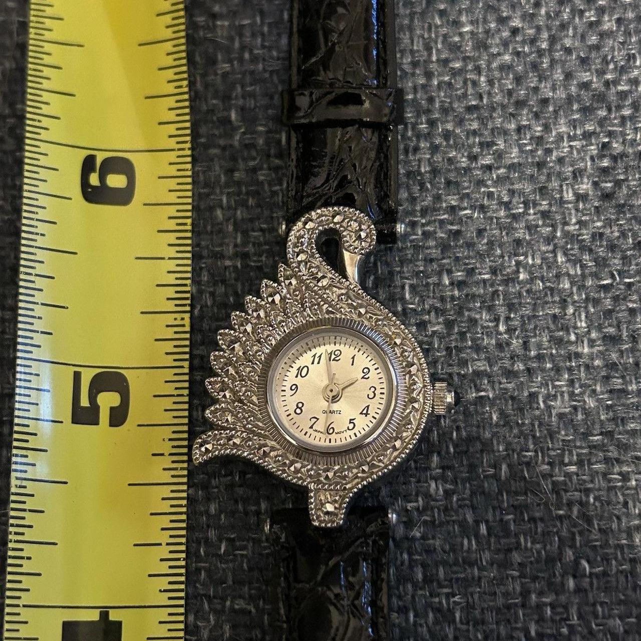 This Avon Swan Marcasite watch for women features a... | Depop
