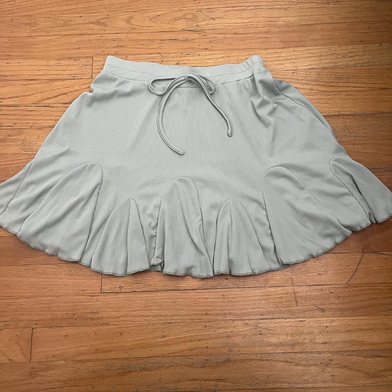 light green mini skirt with ruffles. size small | Depop