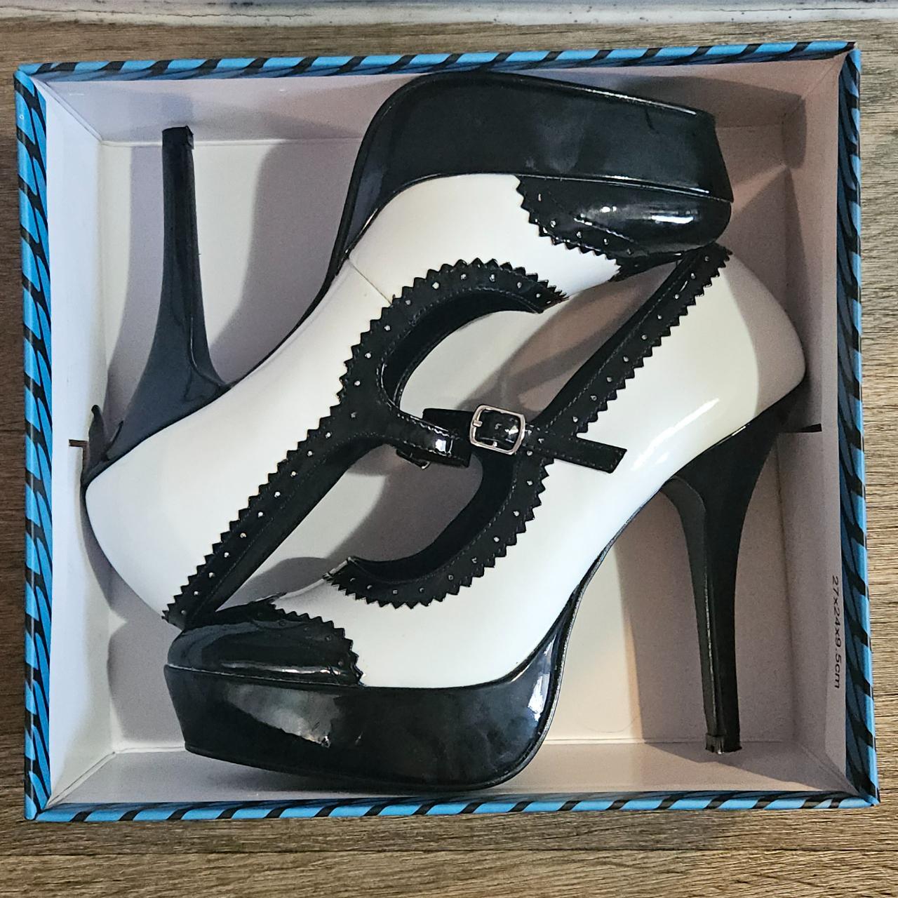 Black and white, wing tip high heels. Only worn once. - Depop