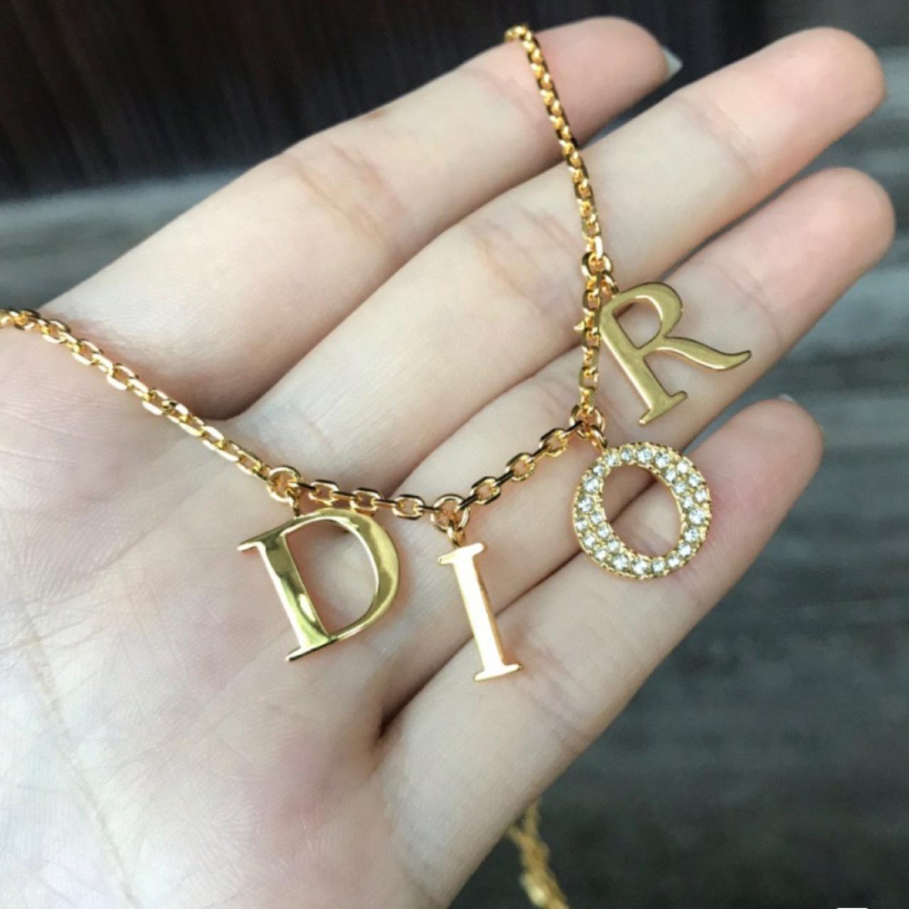 DIOR EVOLUTION Gold-plated metal necklace for women... - Depop