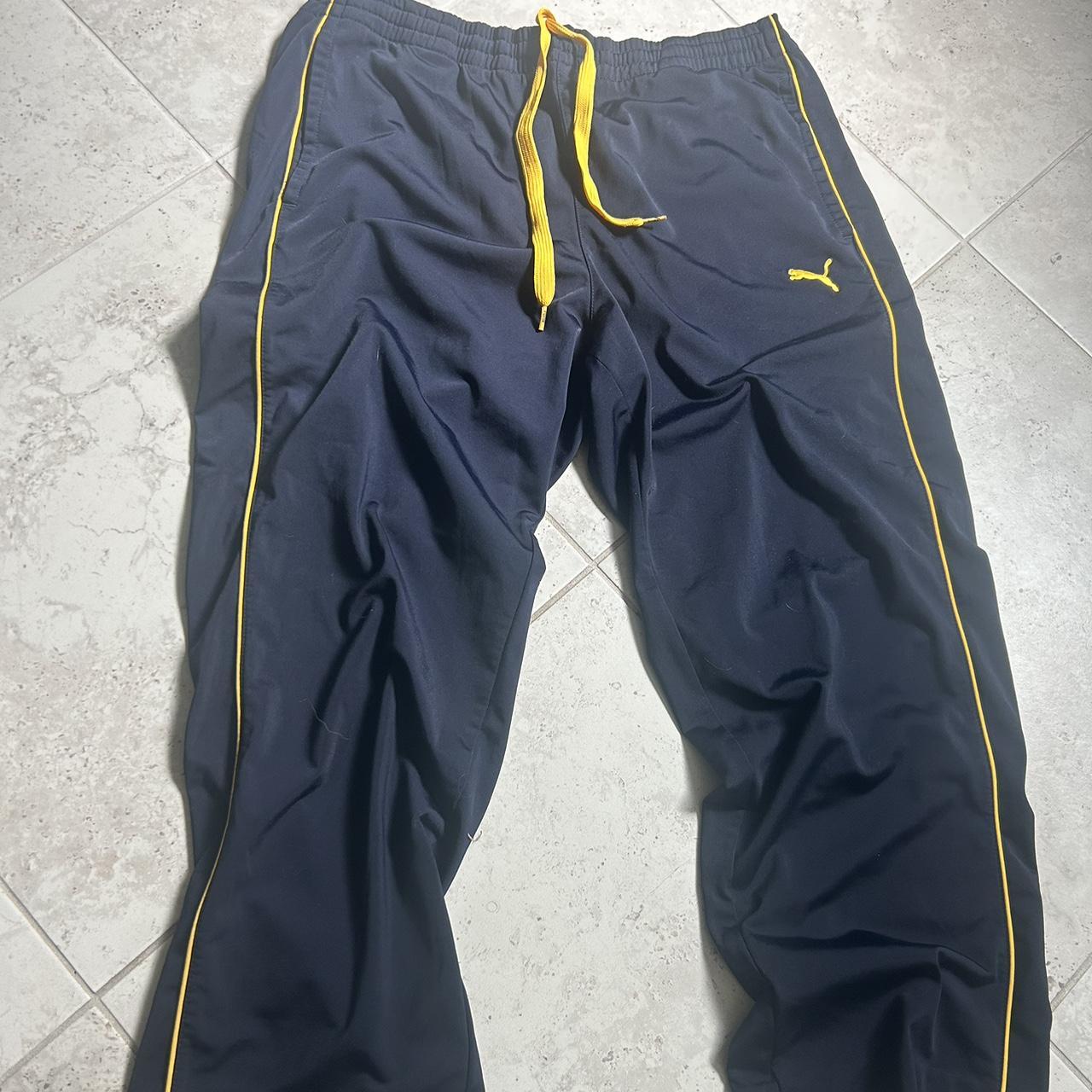 Vintage Puma Trackpants with yellow stripes - Depop