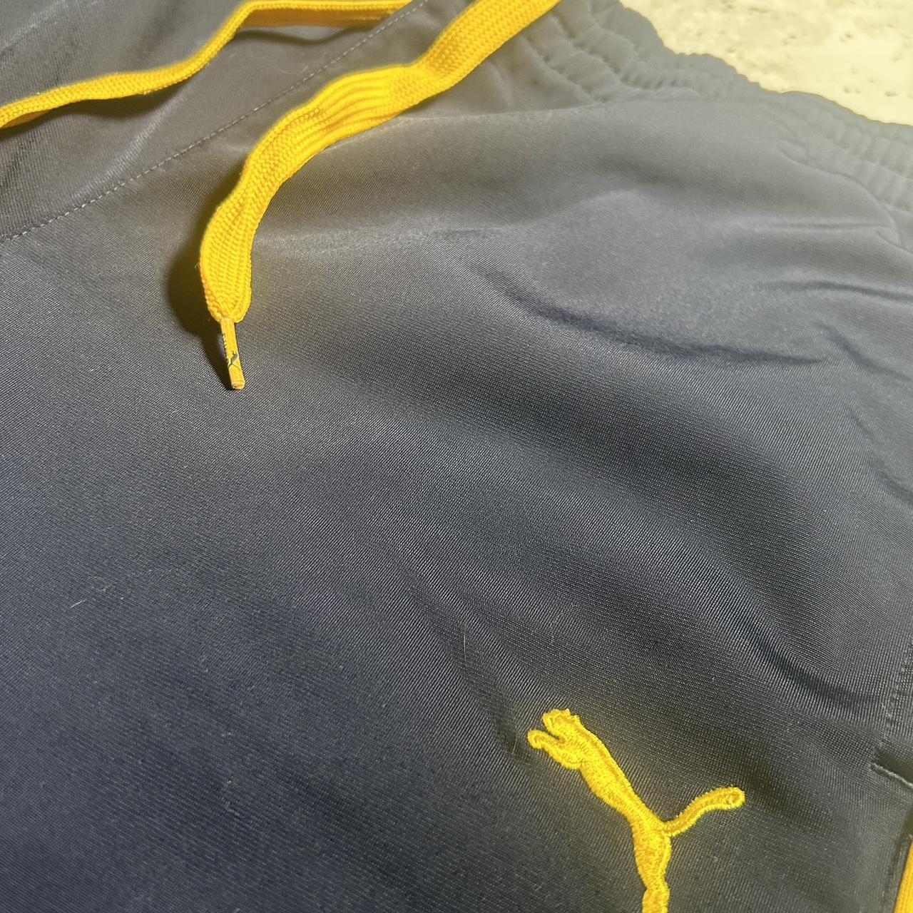 Vintage Puma Trackpants with yellow stripes - Depop