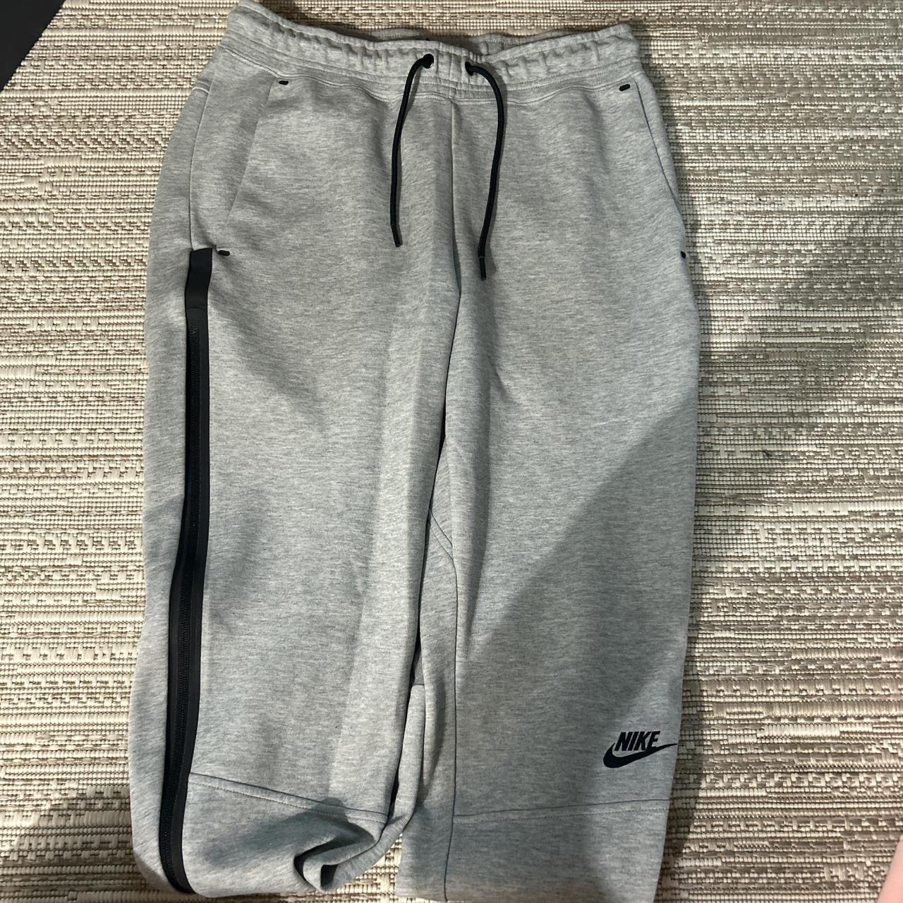 Grey Nike tech fleece sweatpants with black logo and... | Depop