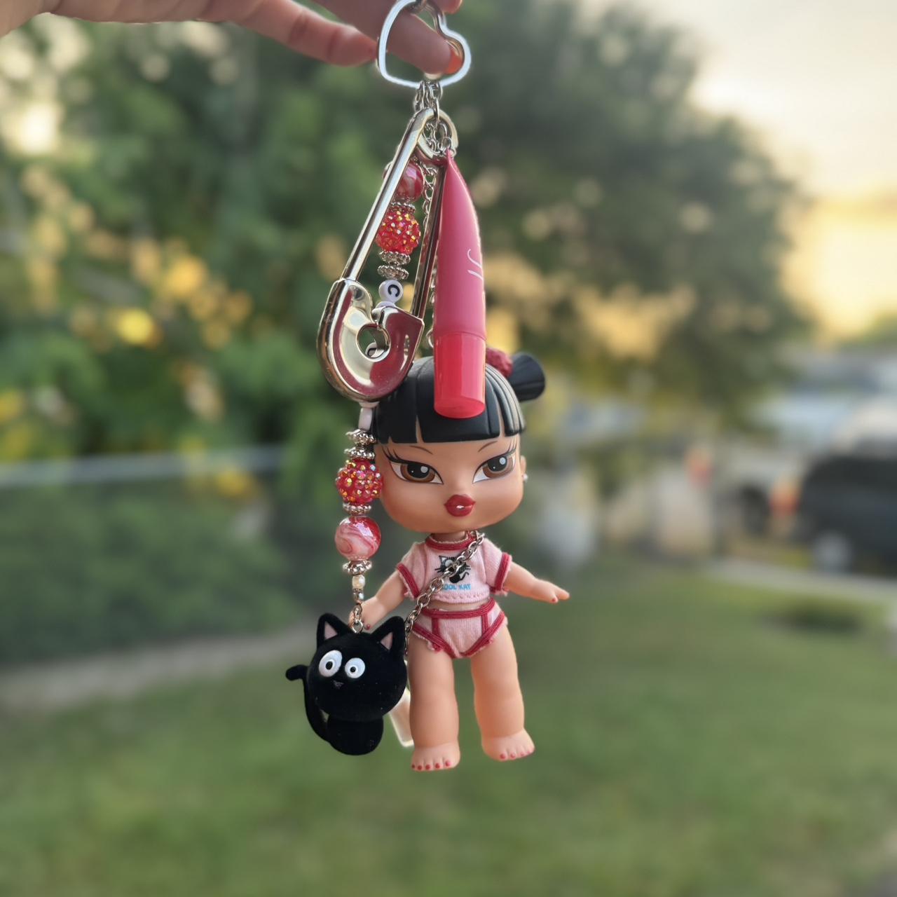 Bratz doll keychain with red and pink details. Send... | Depop