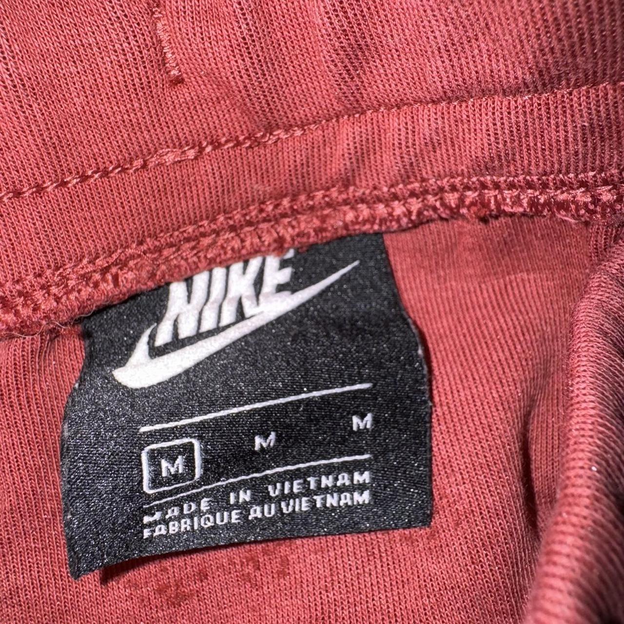 woman red nike tech pants - Depop