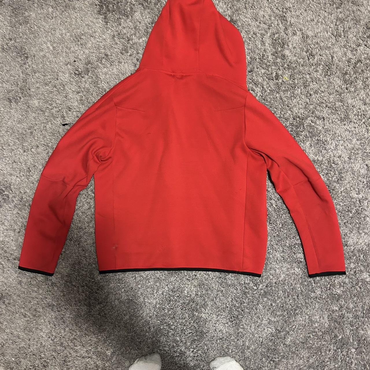 Red Nike tech fleece hoodie the only thing is that... | Depop