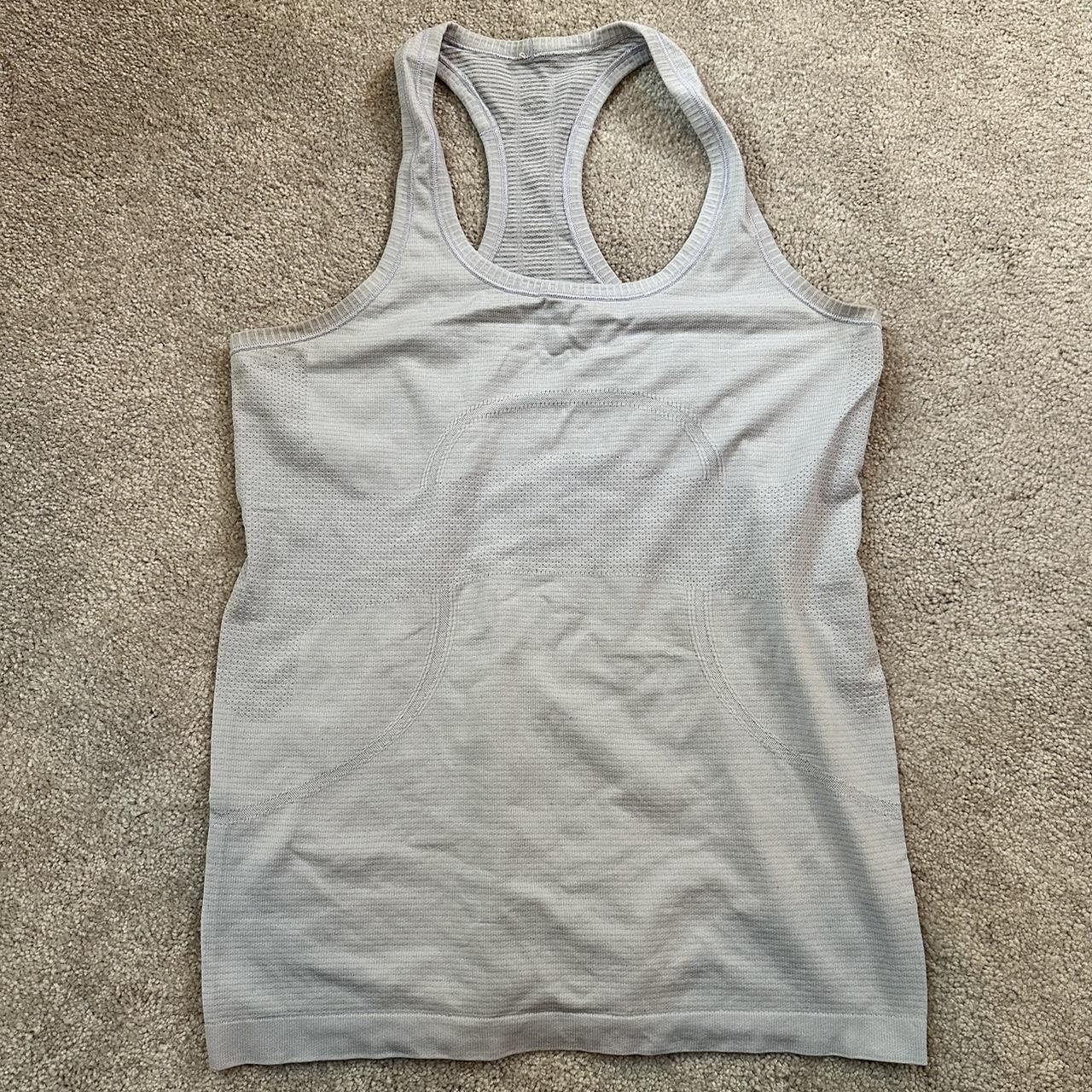 light blue lululemon racerback tank slight... - Depop