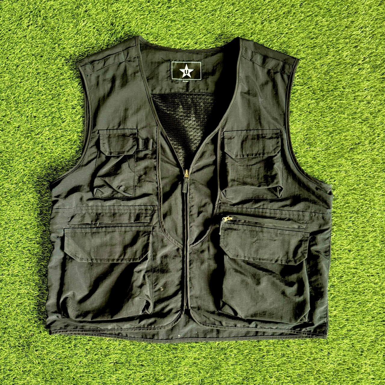Black utility vest with zipper down the middle and 4... - Depop