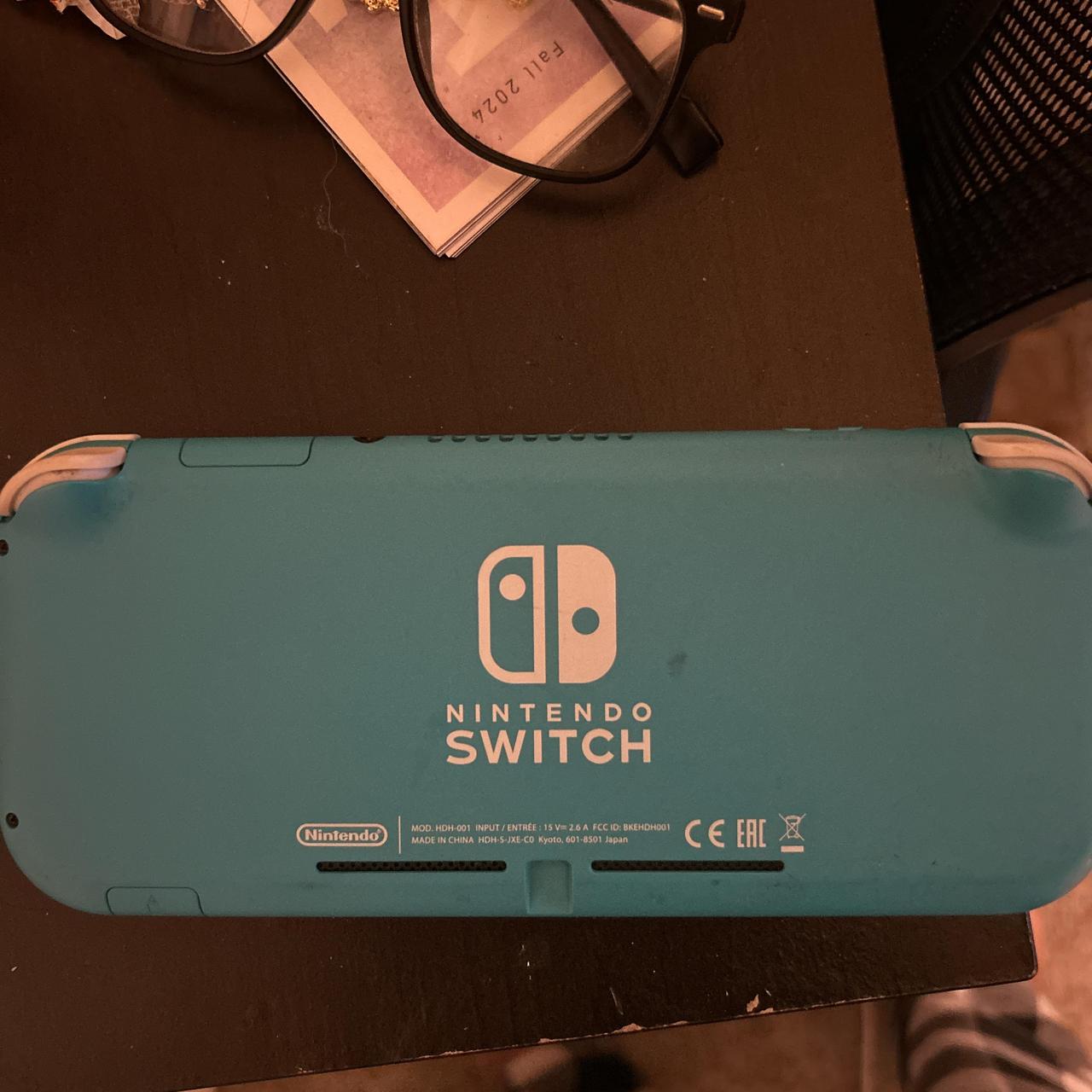 Blue and white Nintendo Switch Lite - Depop