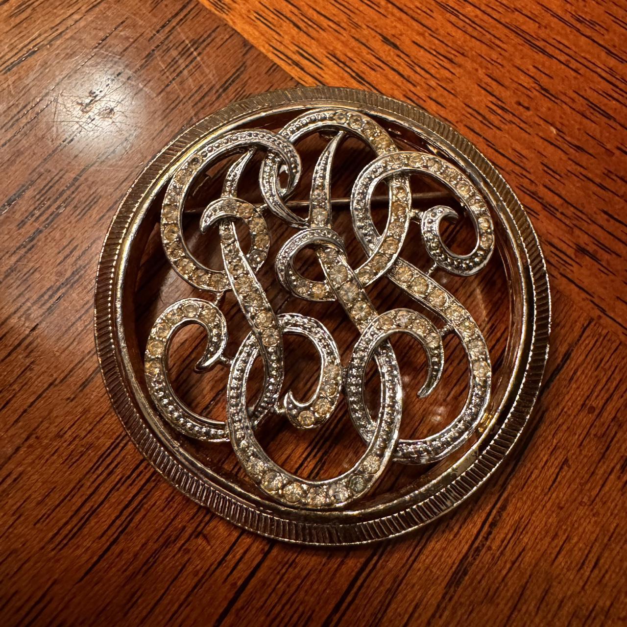 Silver tone monogram brooch with clear rhinestones... | Depop
