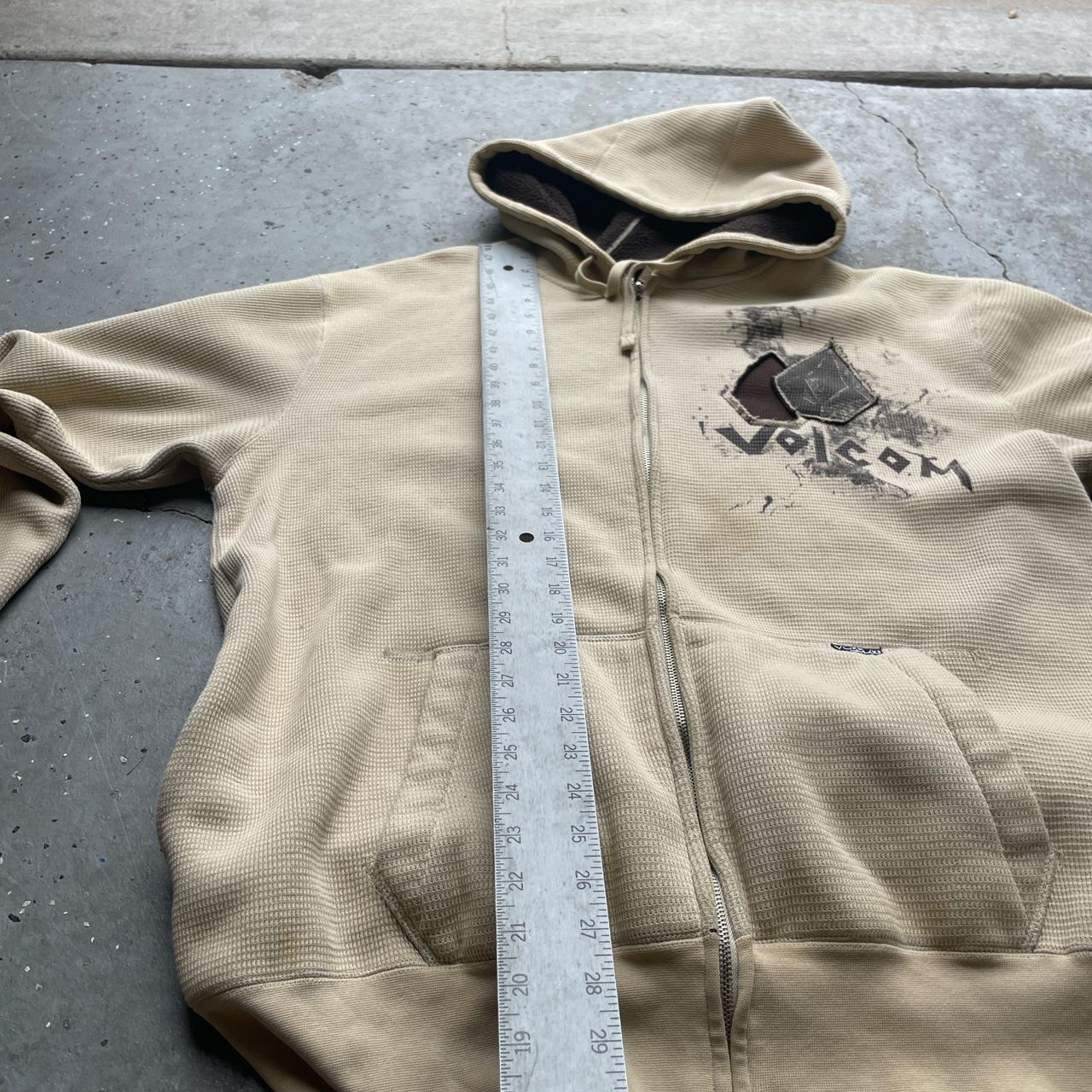 Volcom cream and black zip up hoodie with a sick... - Depop