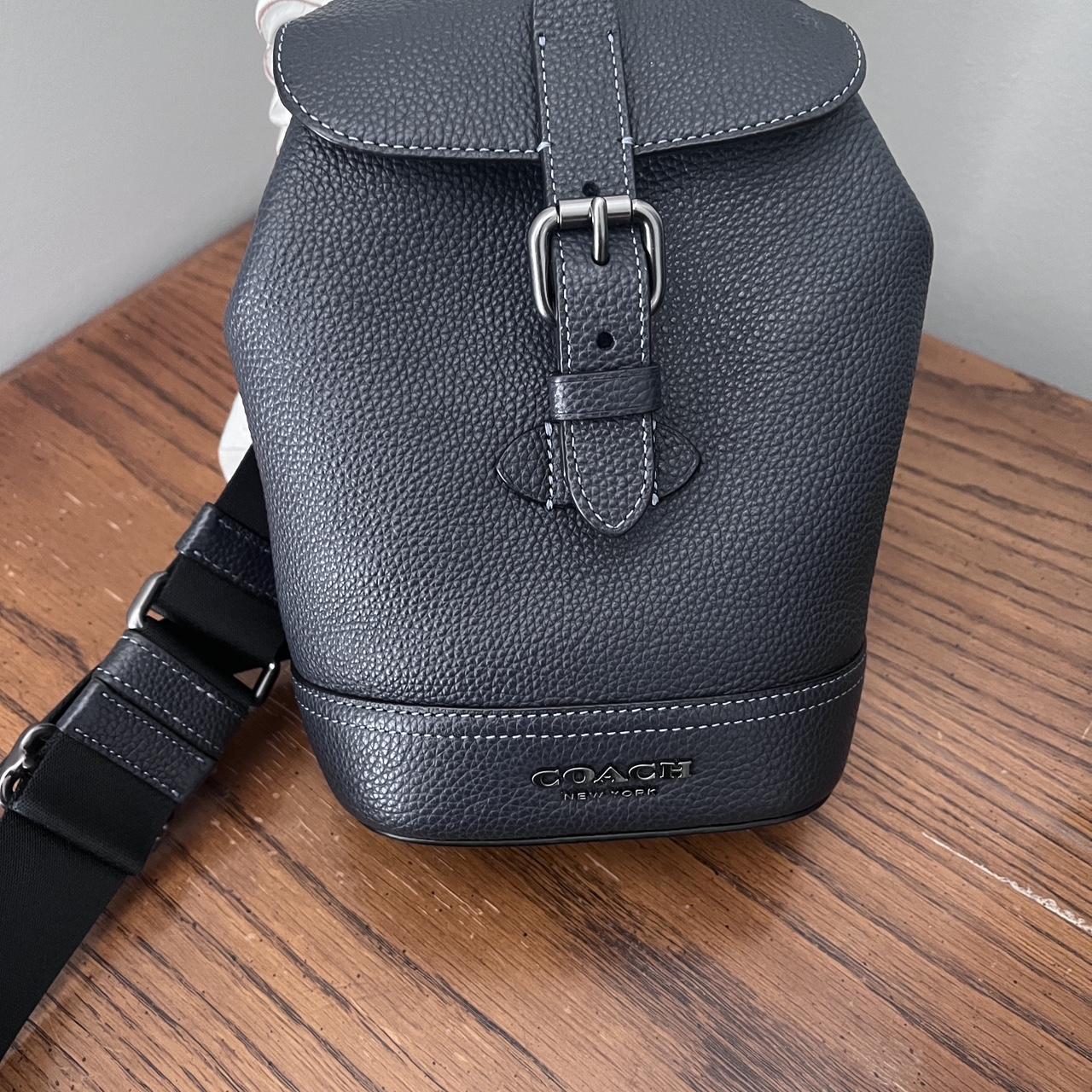 Dark navy blue sling backpack. This bag has two... - Depop